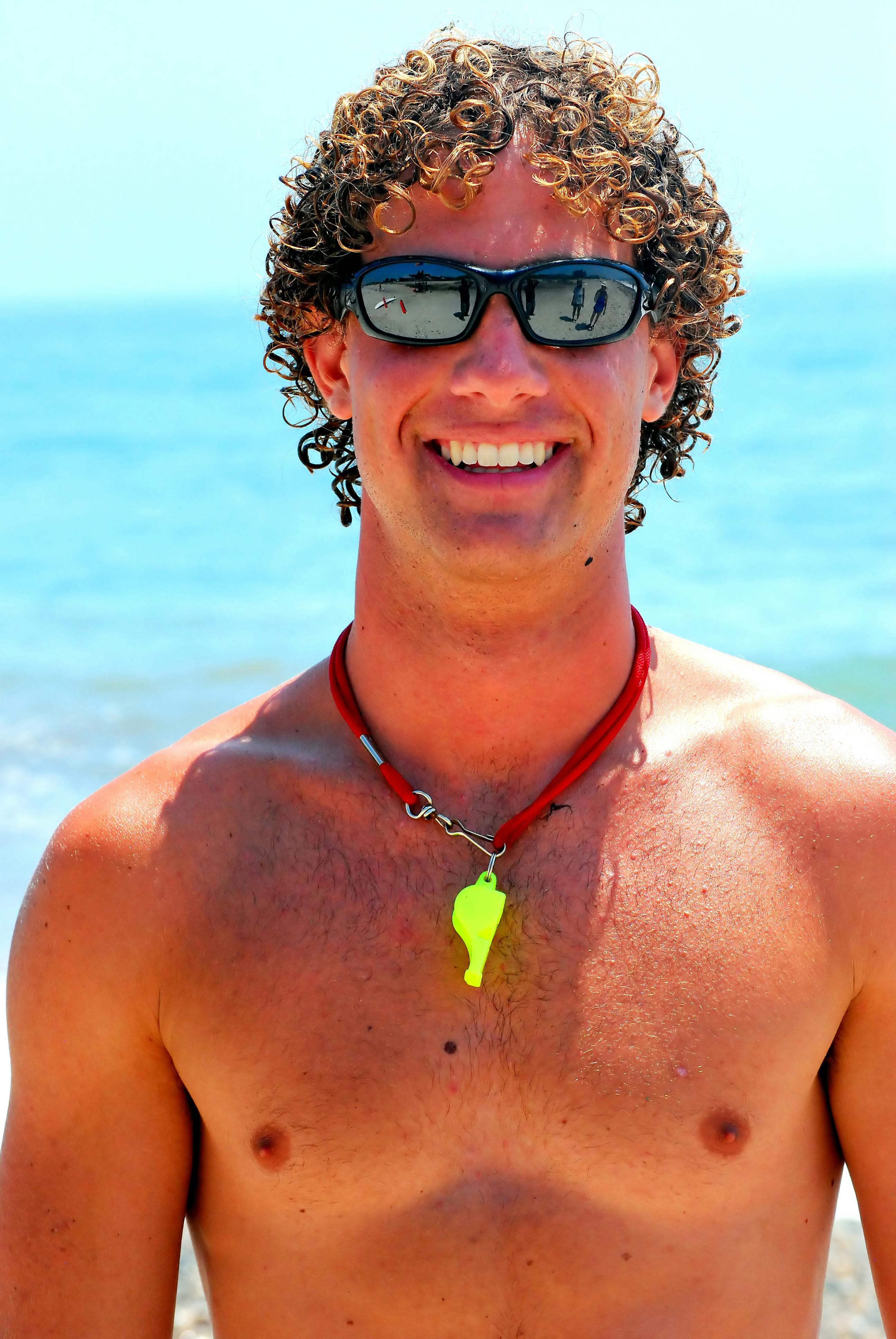 Portrait of a Male Lifeguard Smiling at the Camera · Free Stock Photo
