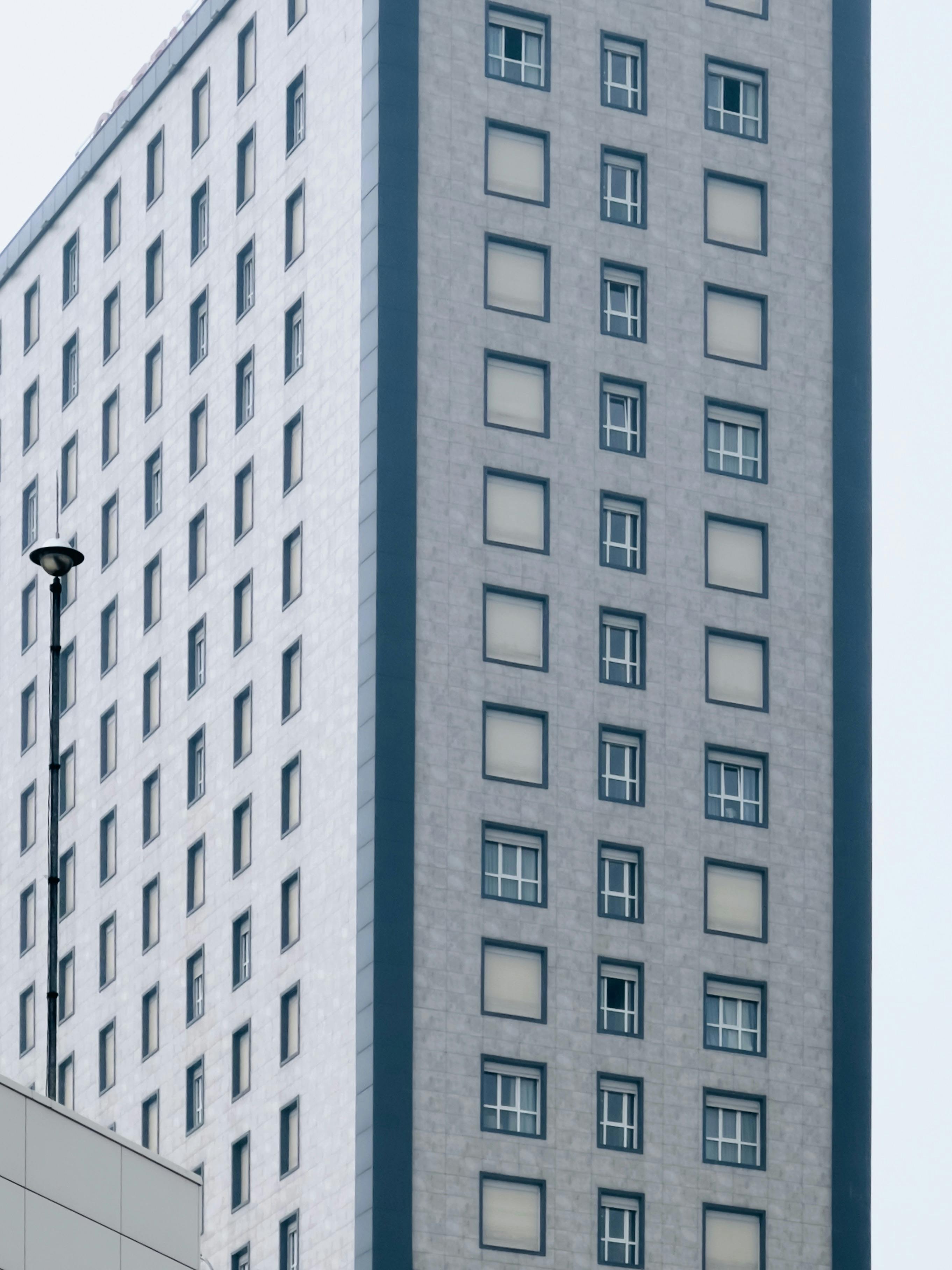 Gray Scale Photo of High-rise Building · Free Stock Photo