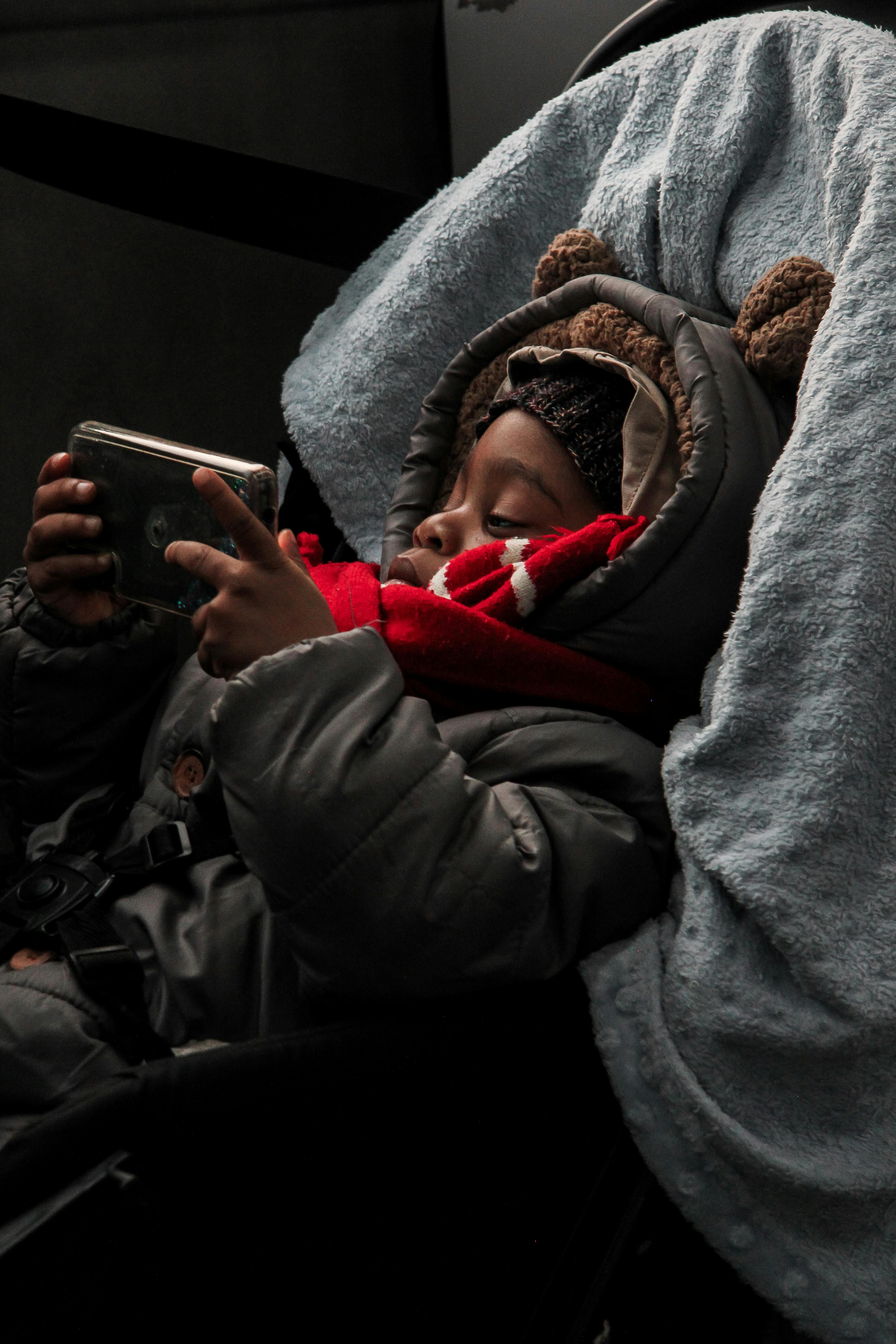 Boy Playing with Cellphone · Free Stock Photo