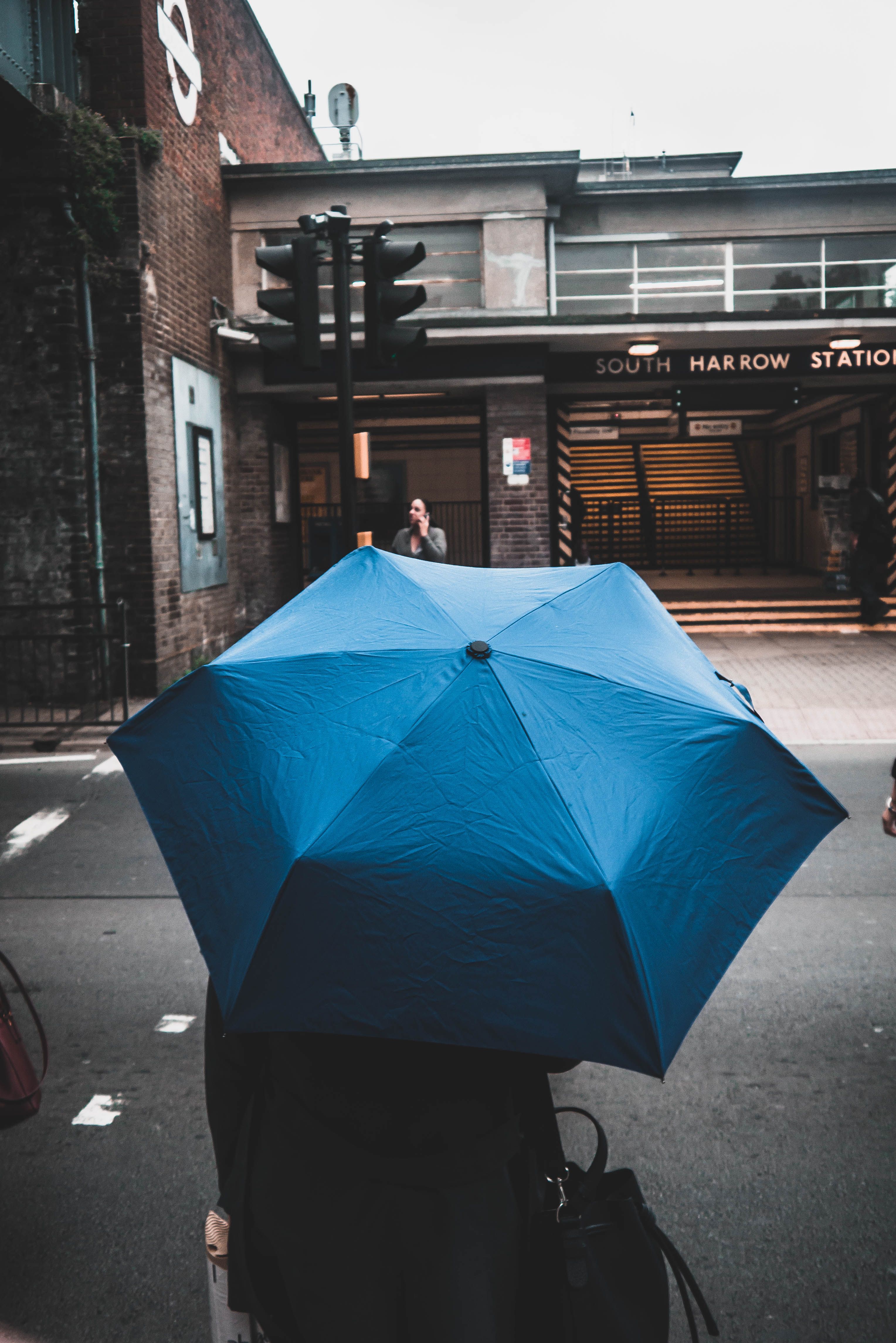 Close up of Wicker Umbrella with Building behind · Free Stock Photo