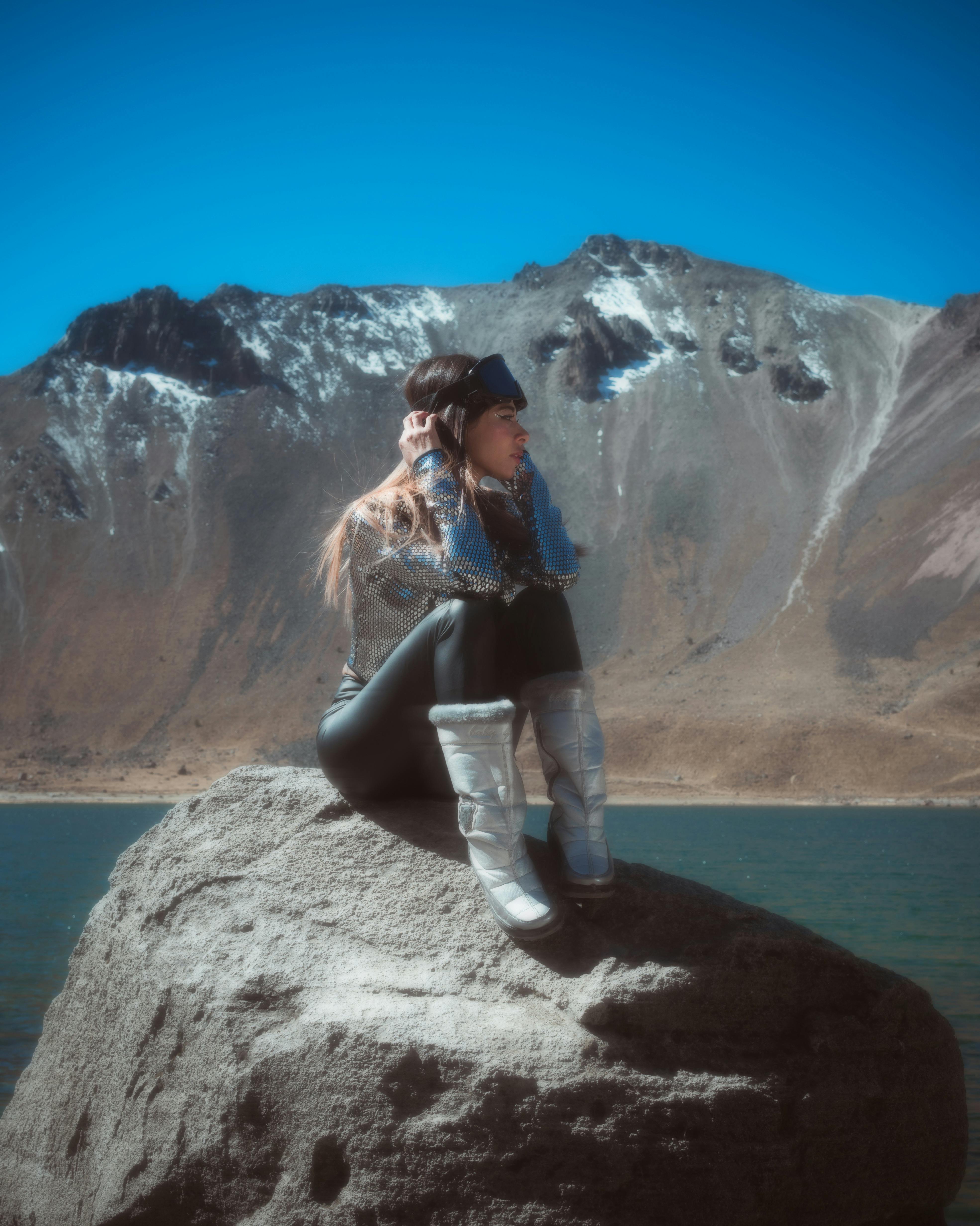 Woman Posing on Rock over Lake in Mountains · Free Stock Photo