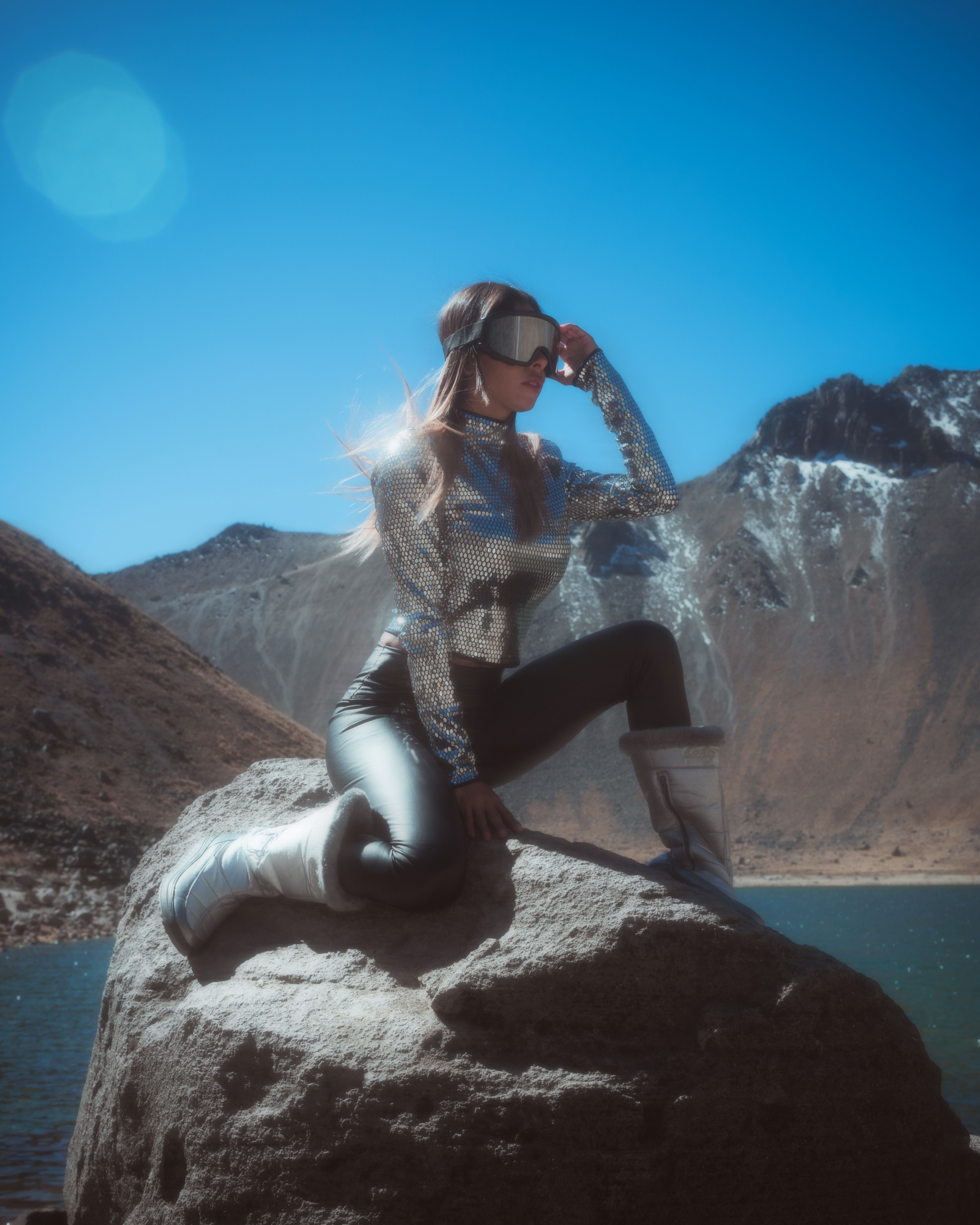 A Fashionable Woman Posing on a Big Rock · Free Stock Photo