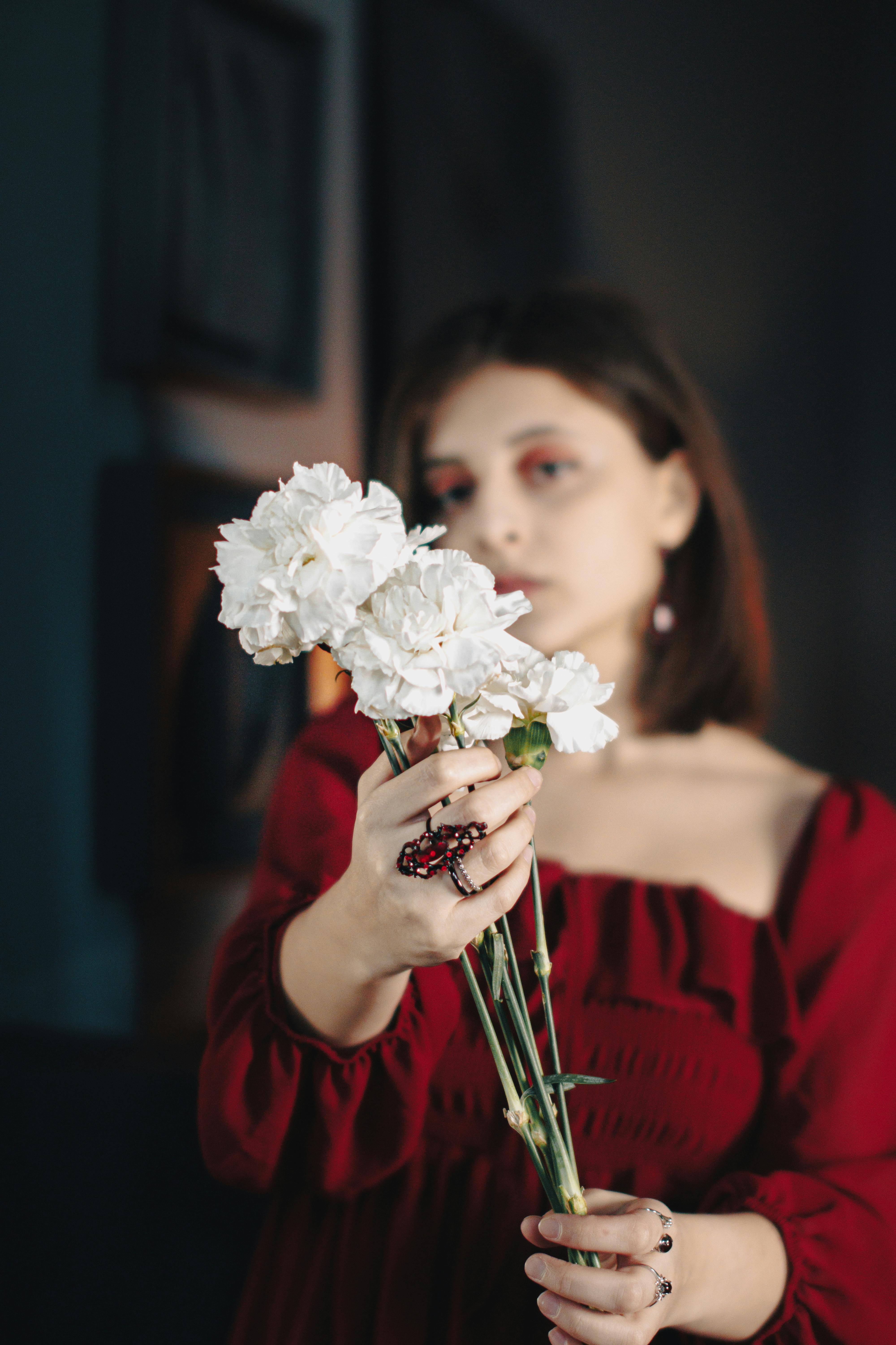 Serious Woman with Flowers · Free Stock Photo