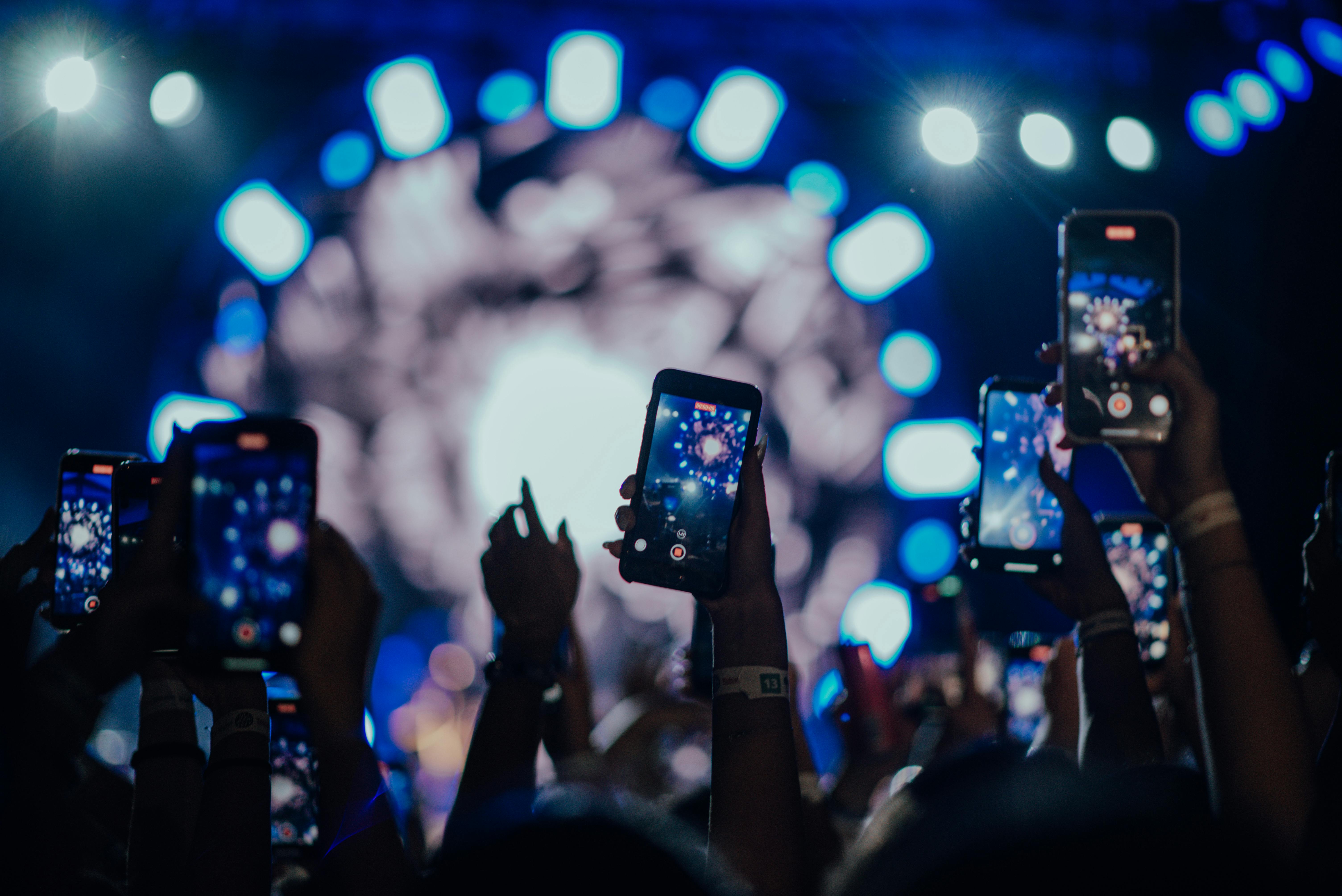 Hands with Smartphones Filming Concert · Free Stock Photo