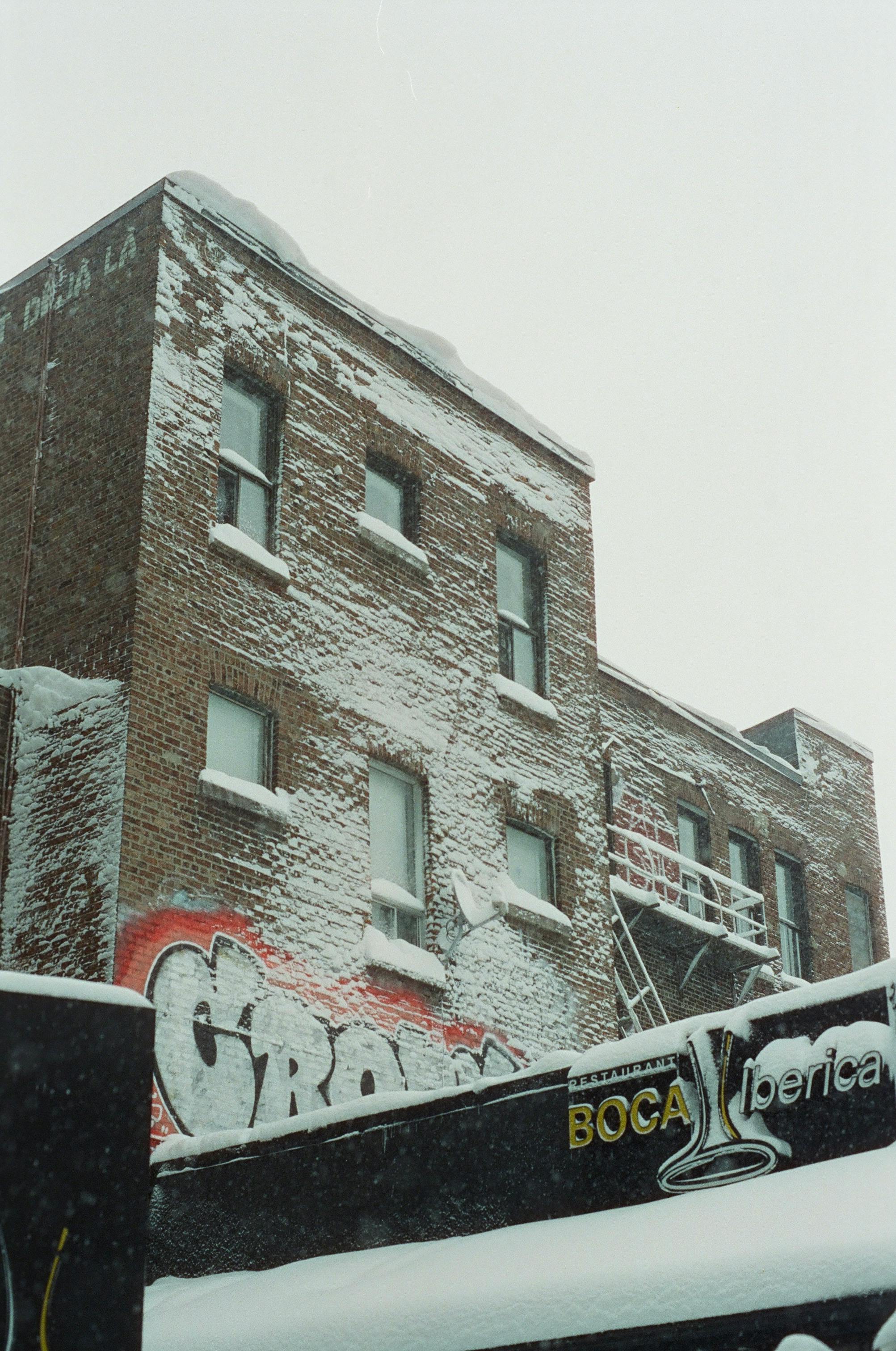 Snow on Brick Building in Town · Free Stock Photo