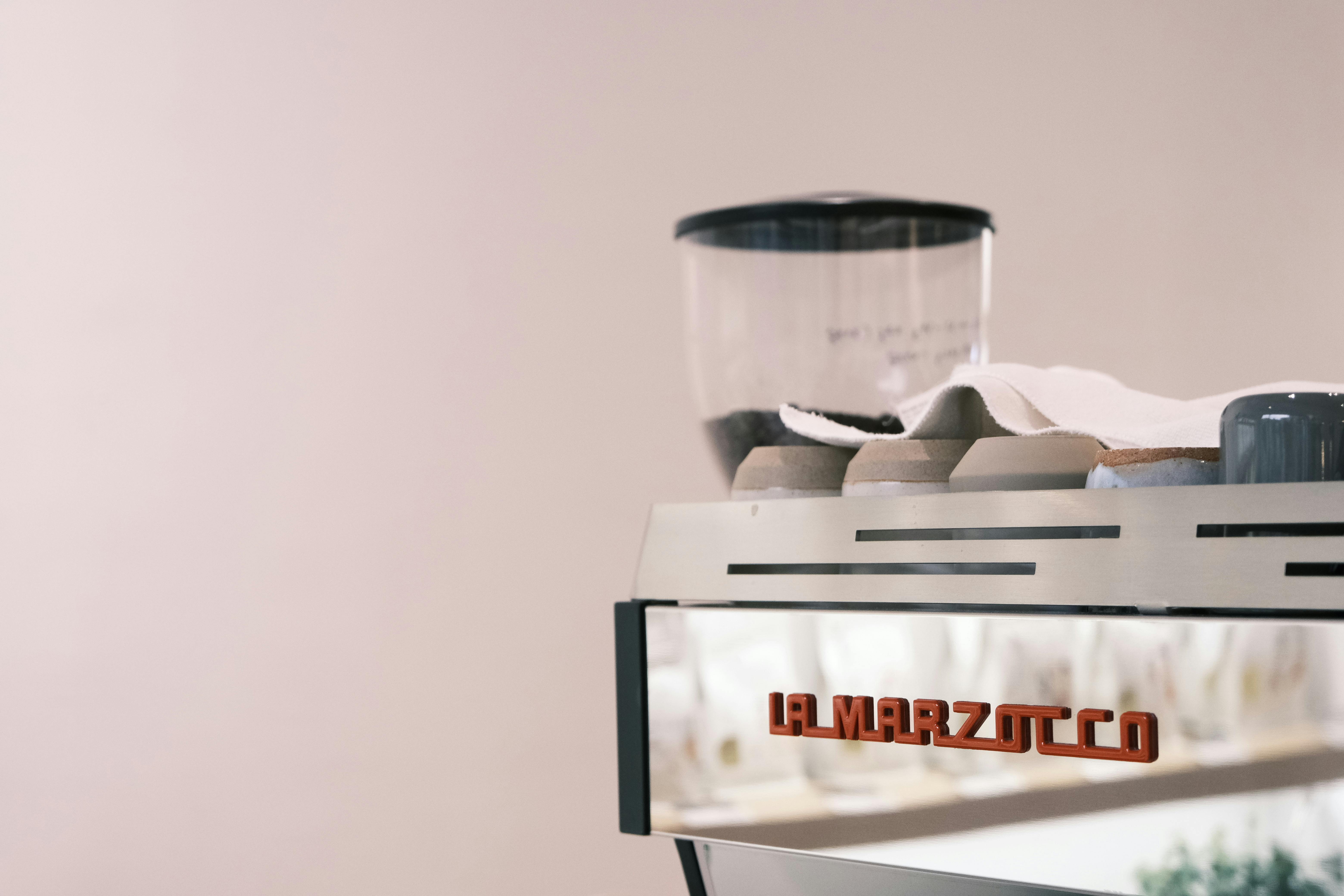 Red La Marzocco Logo on Coffee Machine · Free Stock Photo