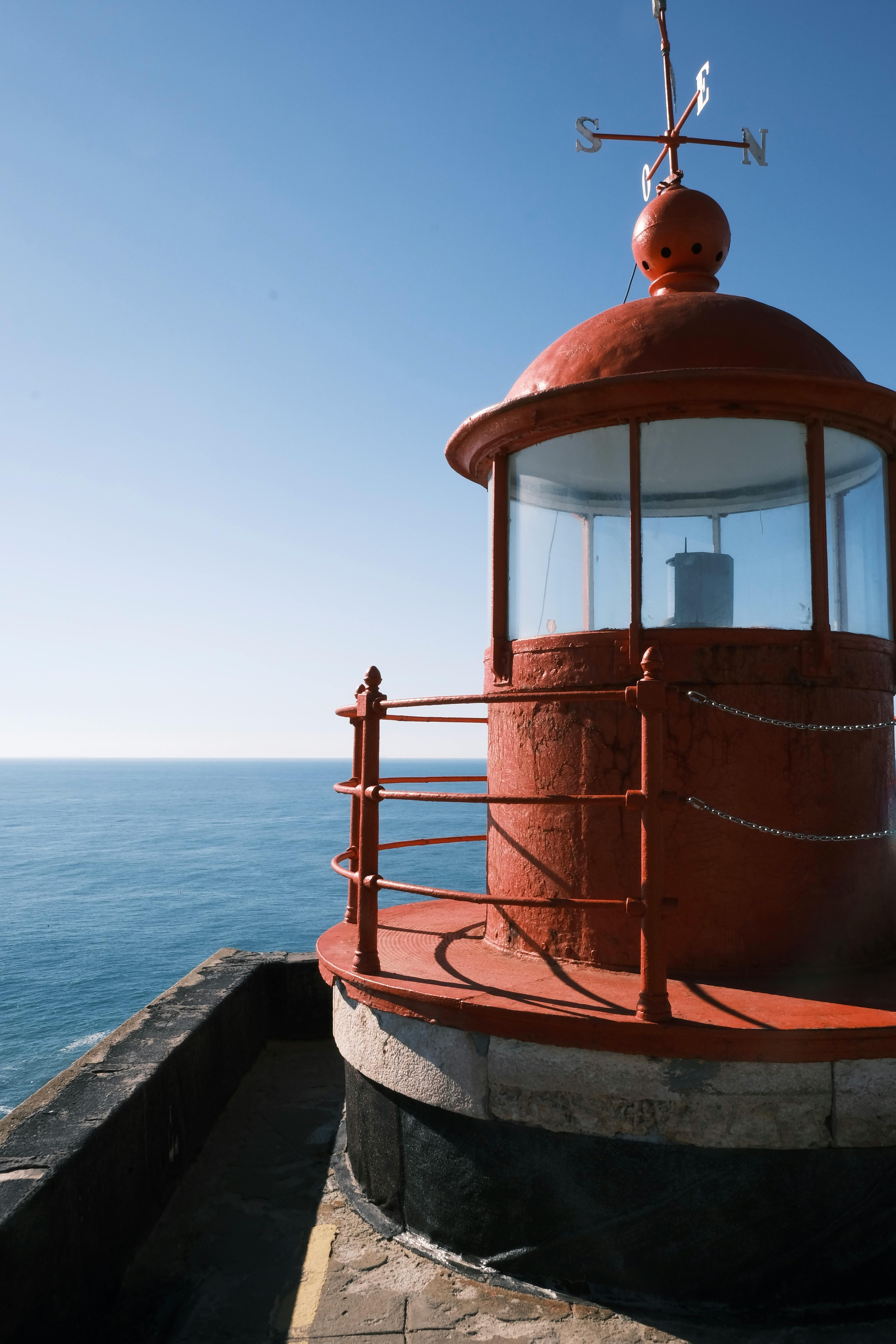Red Lighthouse by Sea Shore · Free Stock Photo