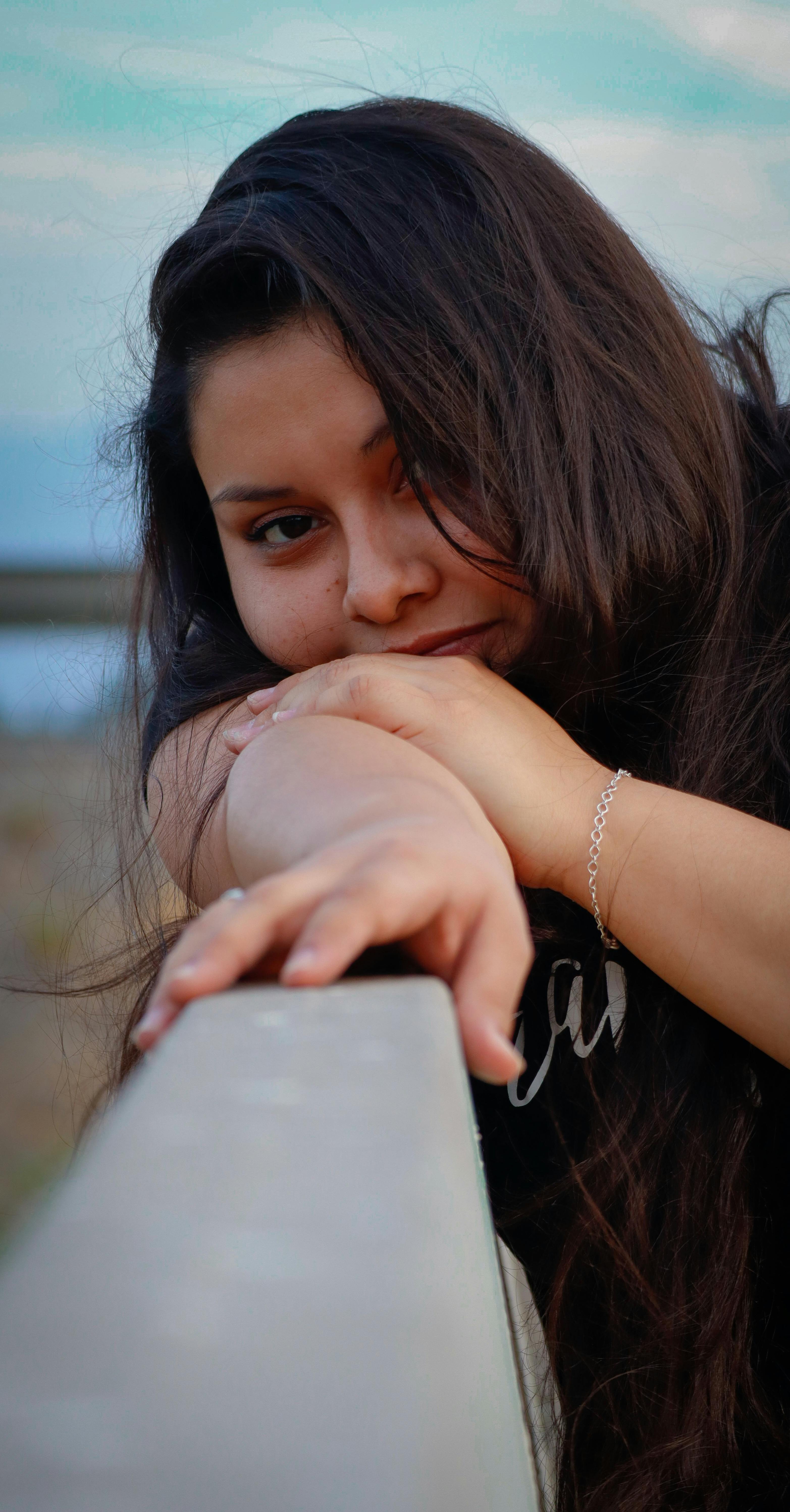 Woman Leaning on Railing · Free Stock Photo