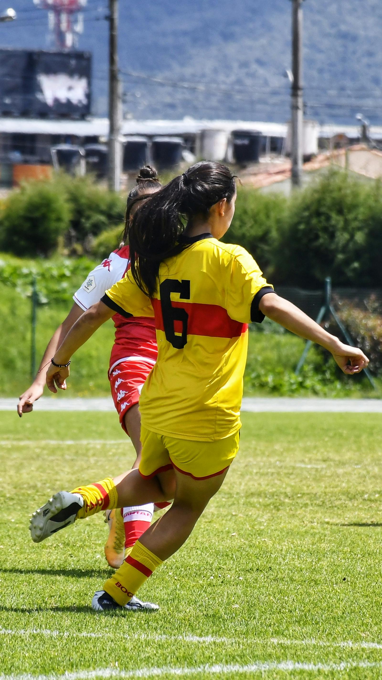 Back View of Women Playing Football · Free Stock Photo