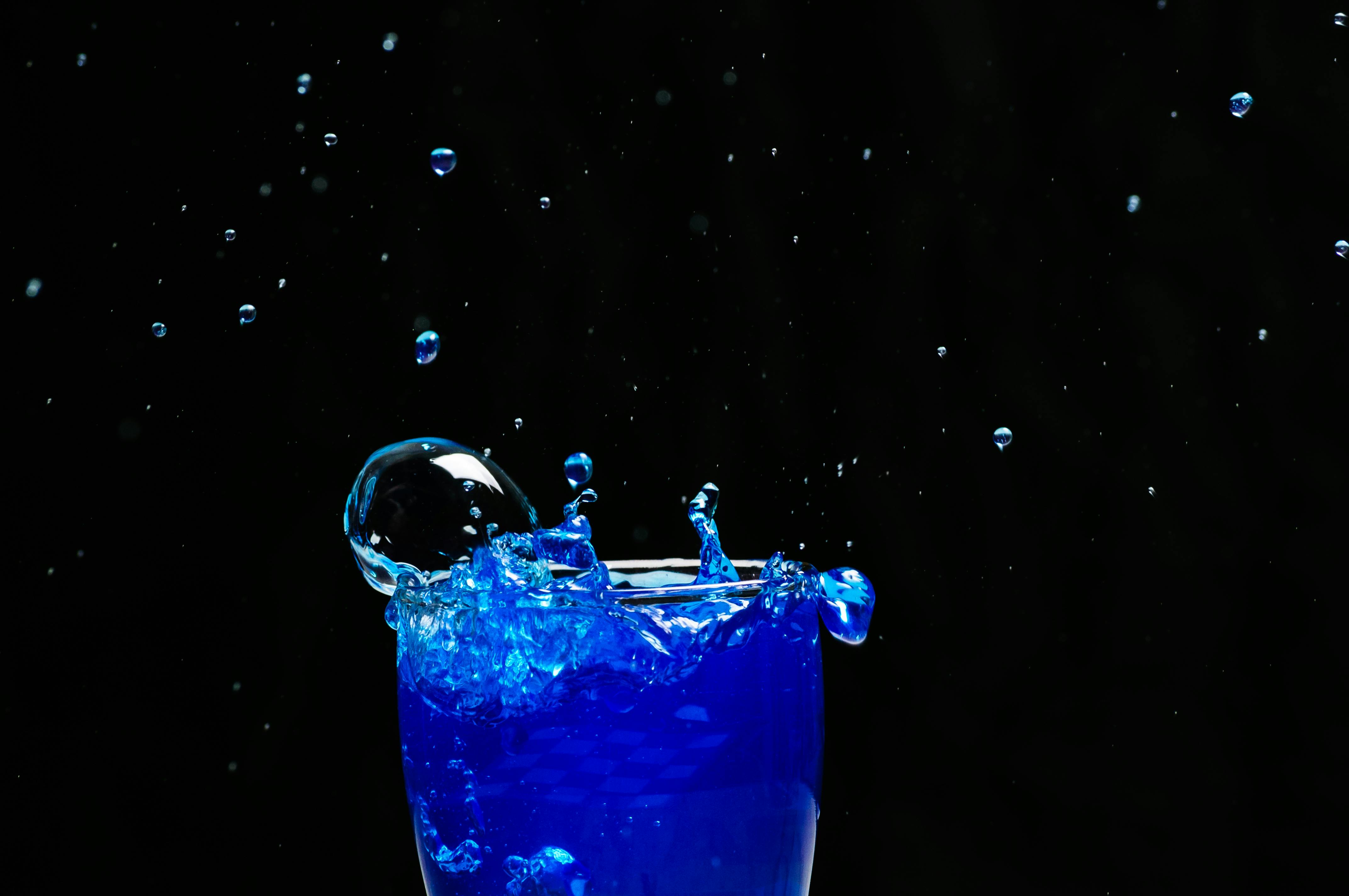 Blue Liquid Splash on Glass · Free Stock Photo