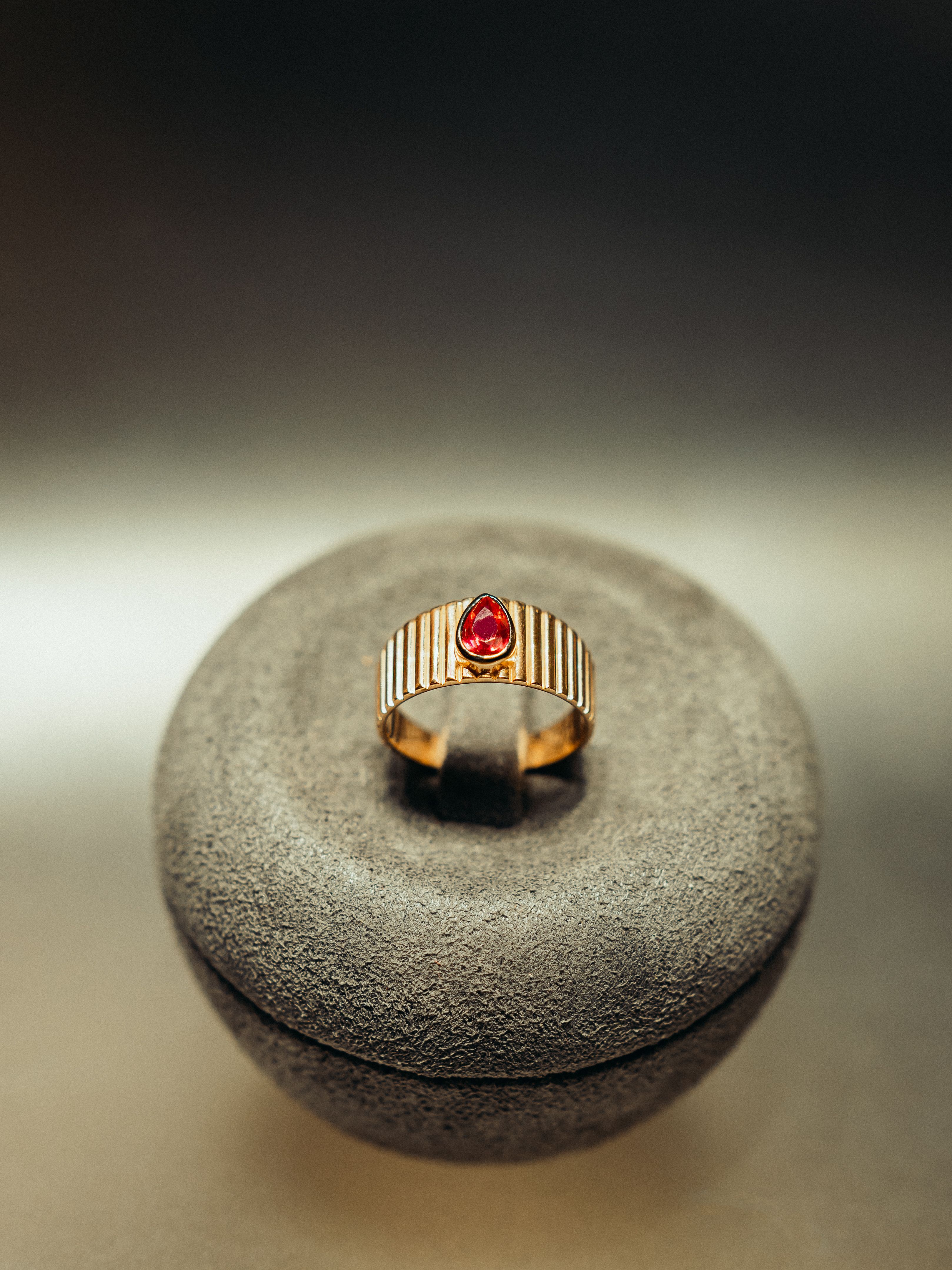 Ring with Red Stone on Rock · Free Stock Photo