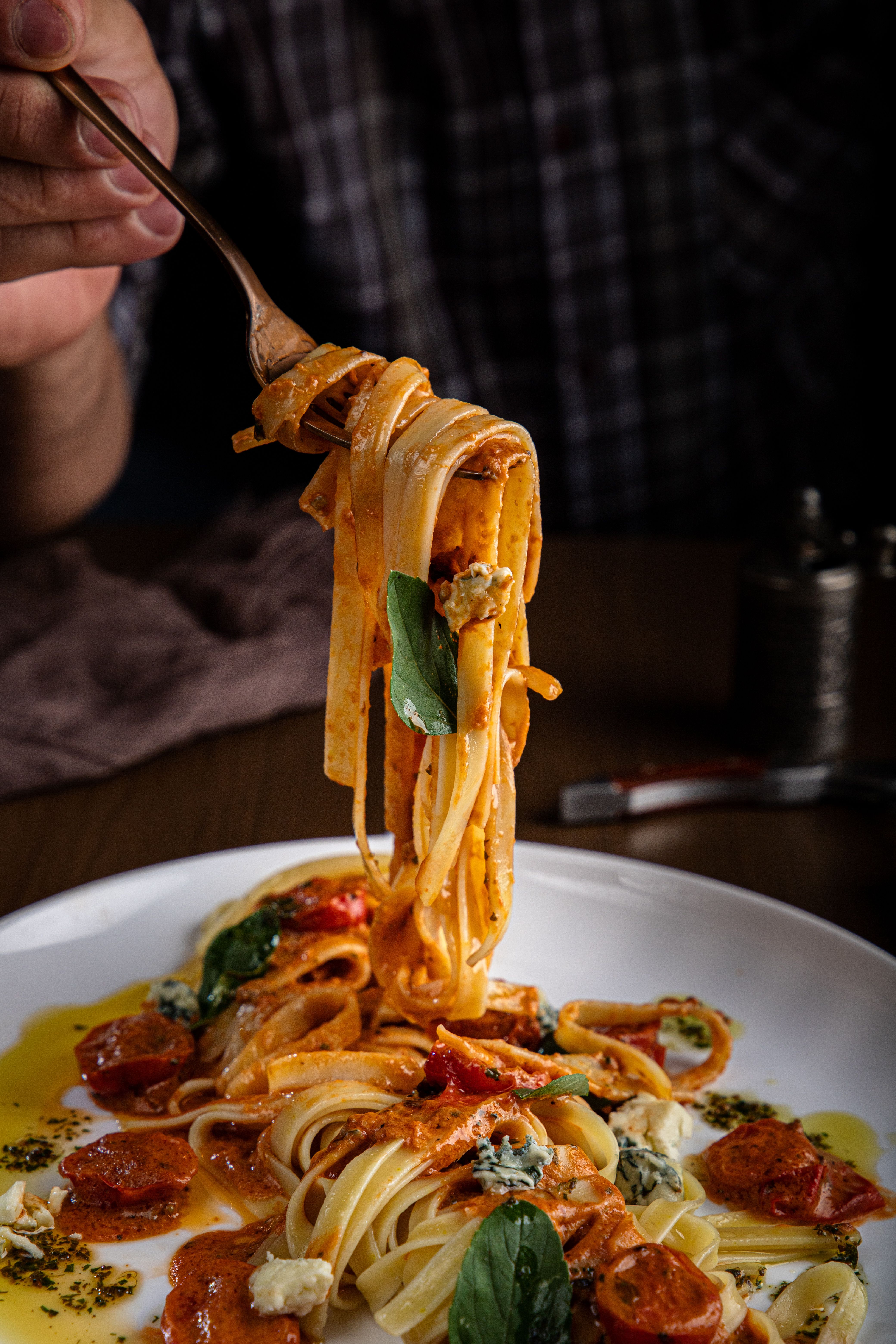 Fingers Holding Fork with Pasta · Free Stock Photo