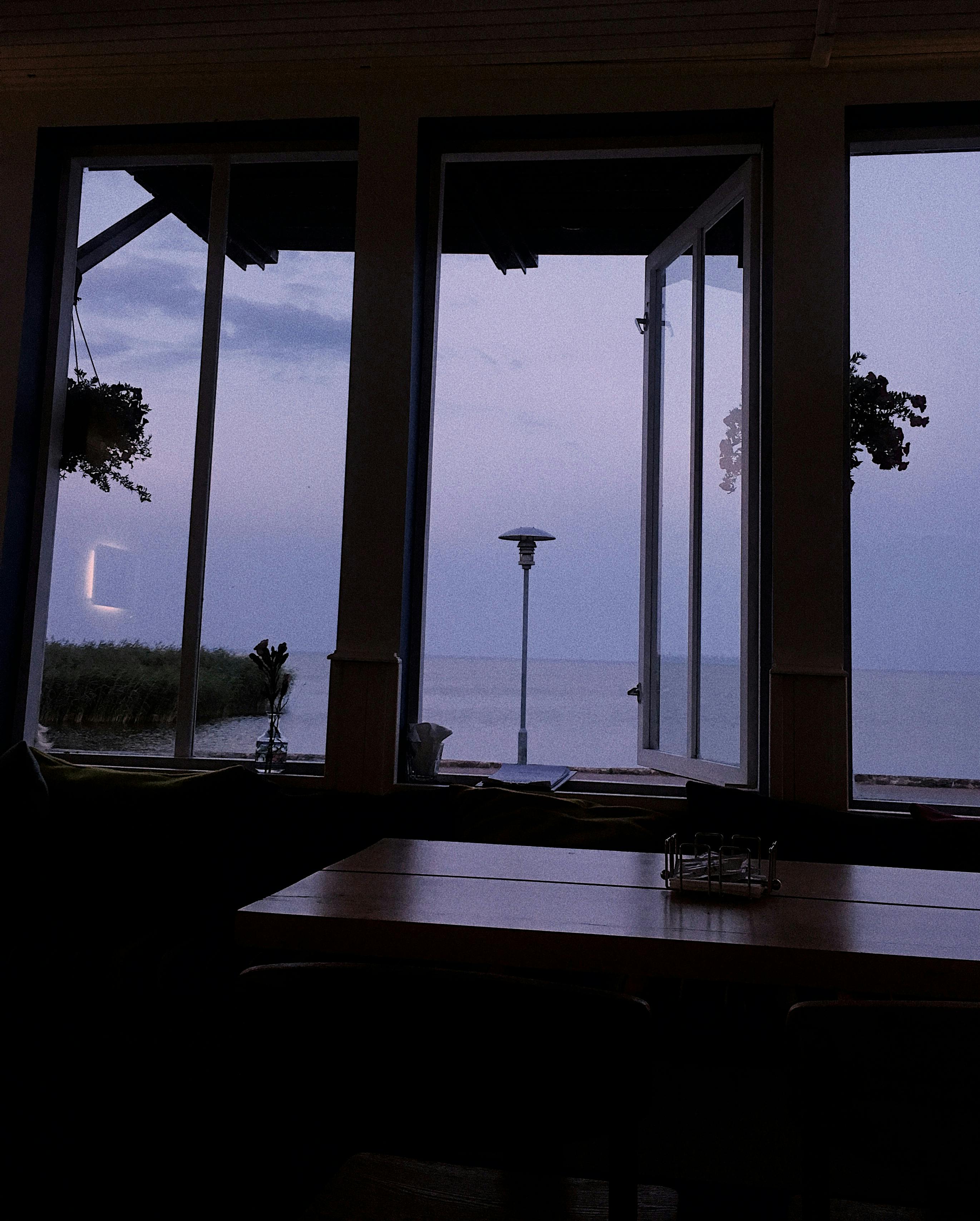 Brown Wooden Table Near the Window · Free Stock Photo