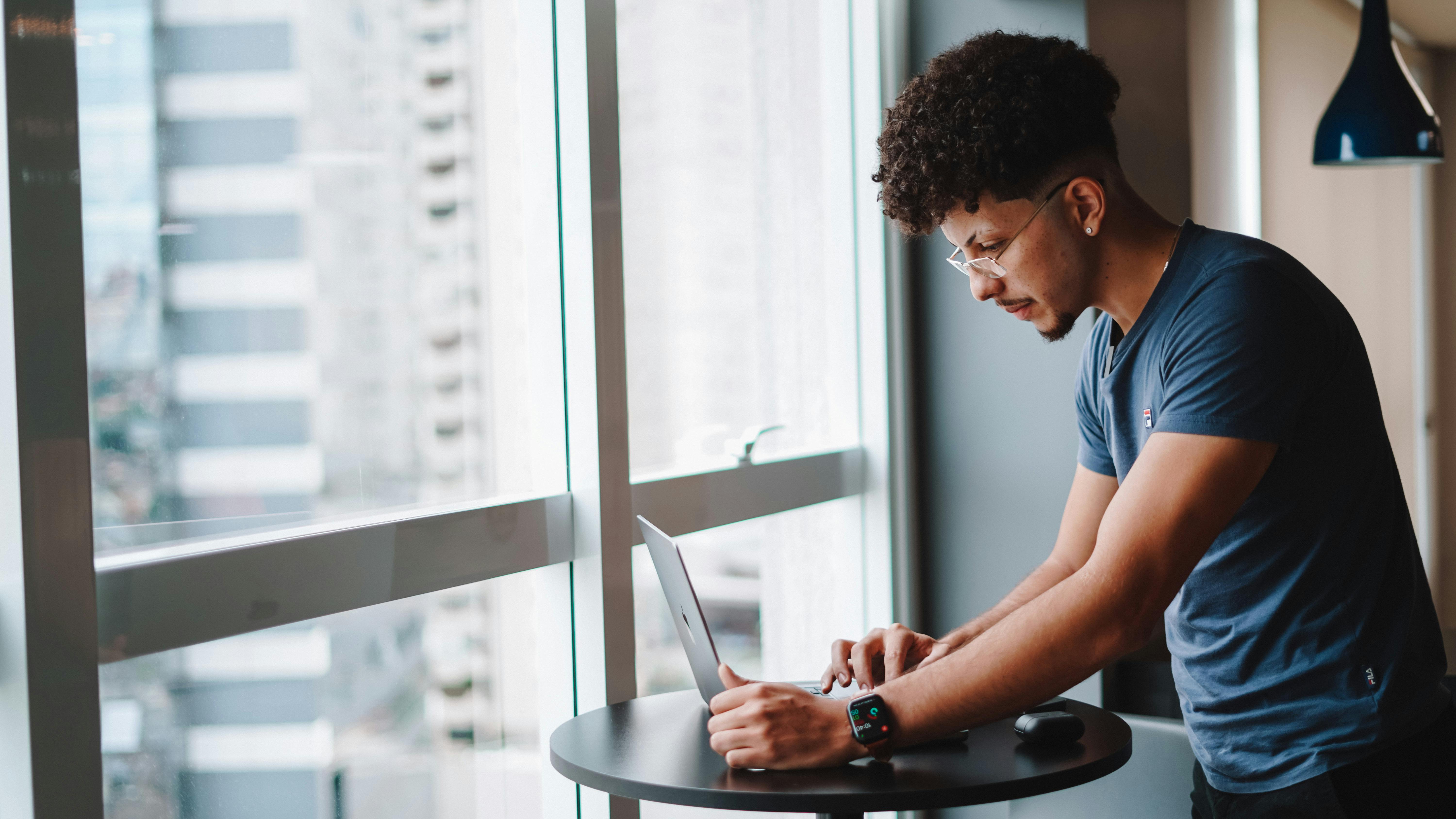 Man Using his Laptop Computer · Free Stock Photo