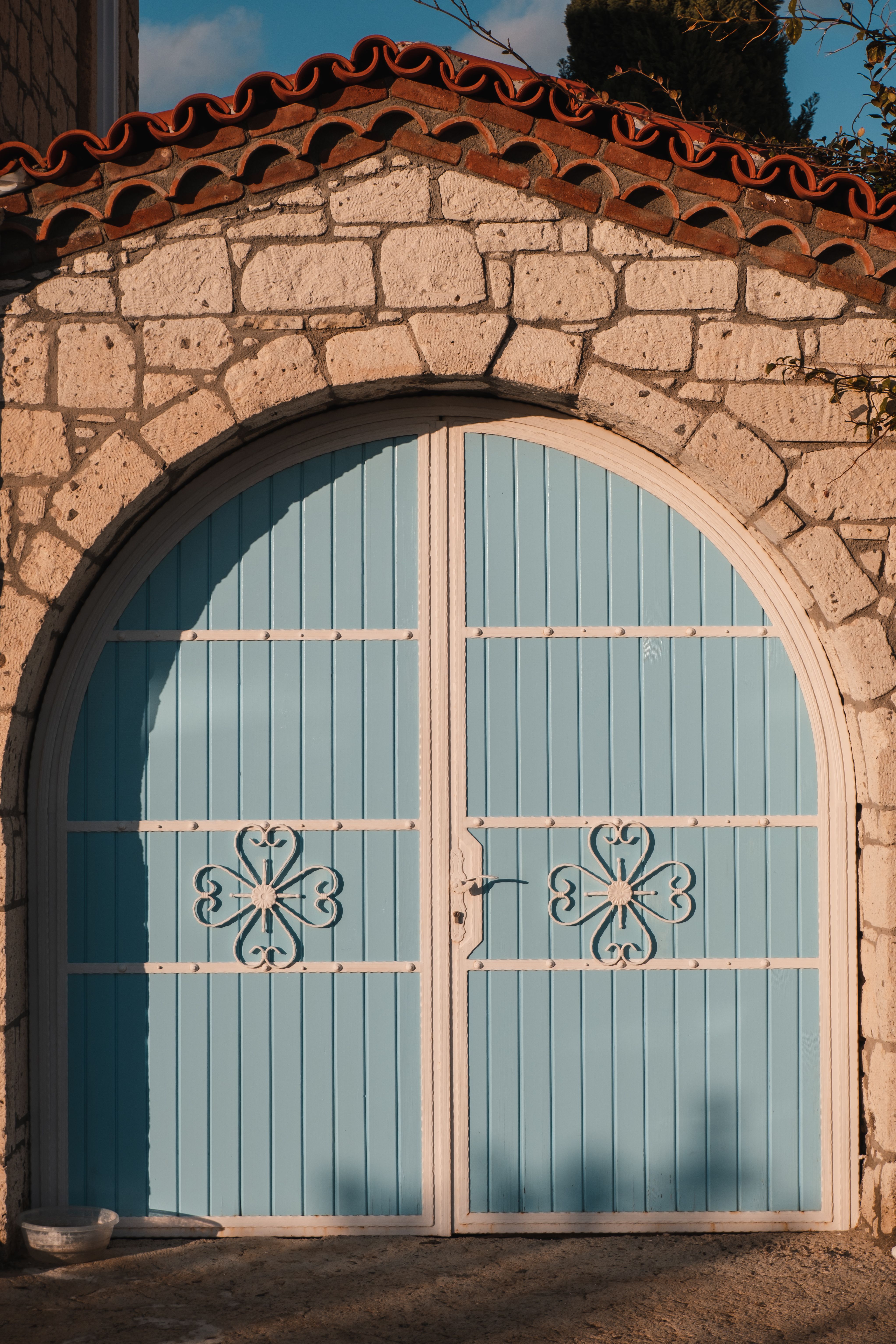 Brick Wall with Blue and White Gate · Free Stock Photo