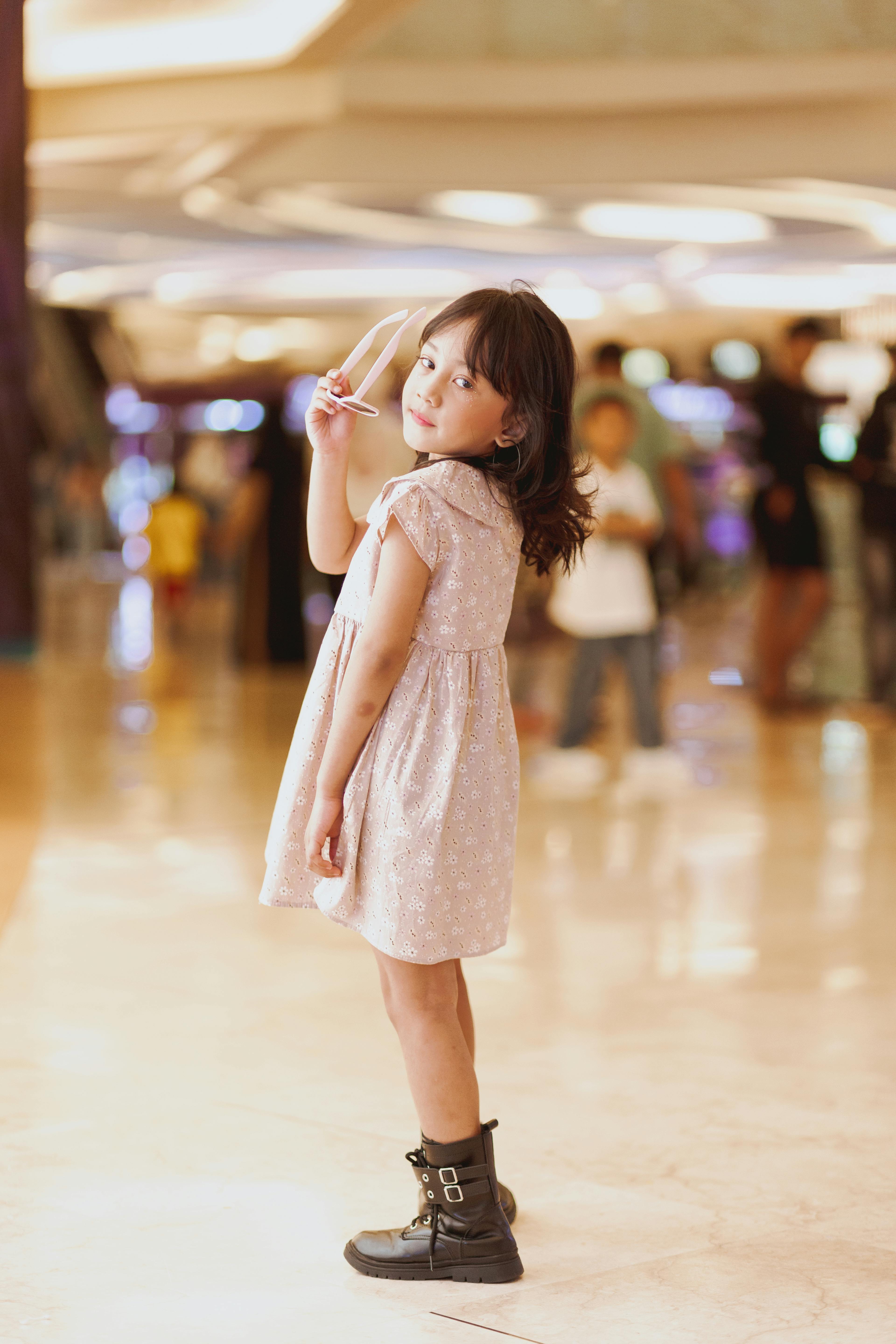 Photo of a Girl Wearing a Dress and Black Boots · Free Stock Photo