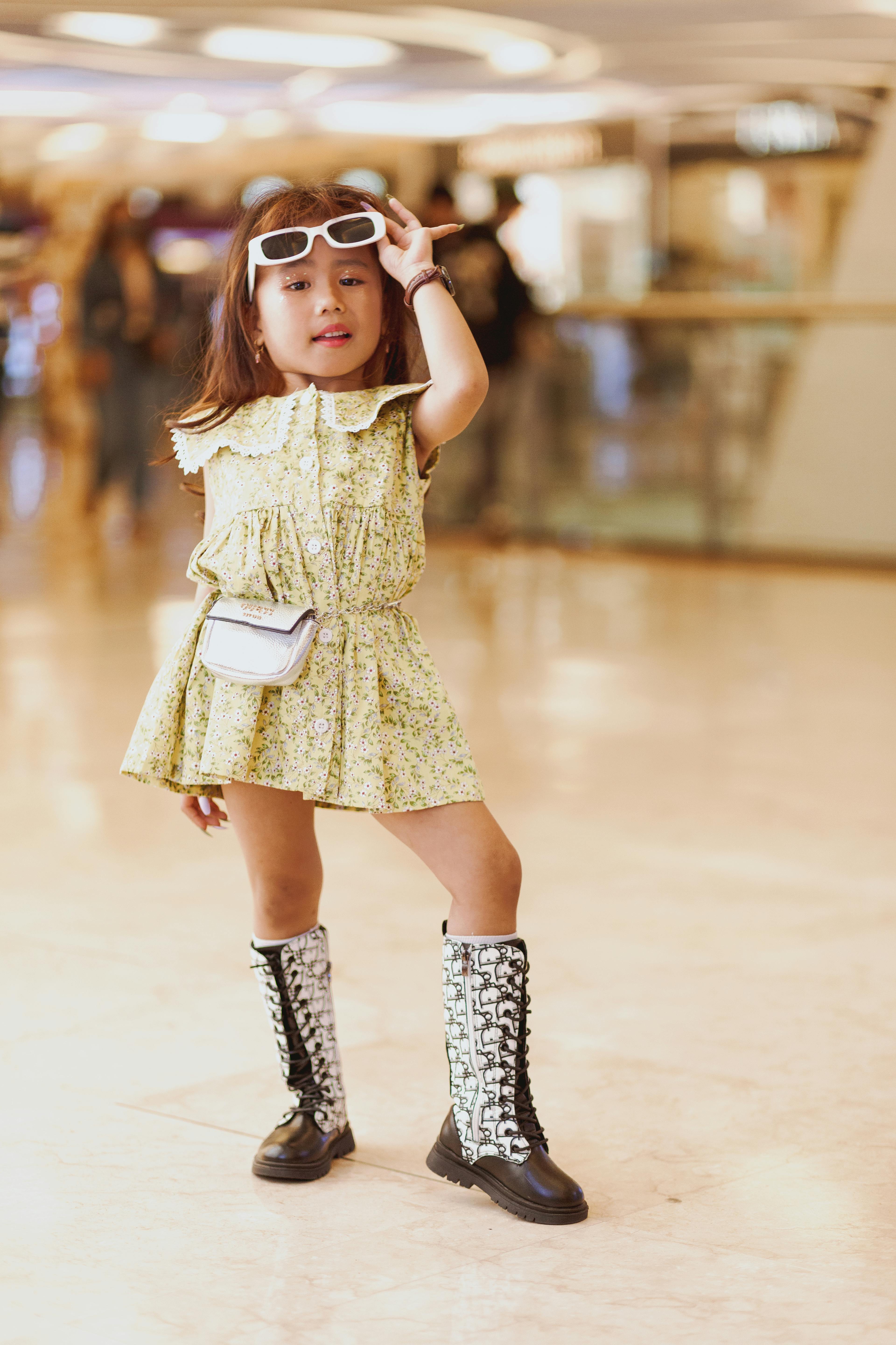 Photo of a Child in a Dress Posing · Free Stock Photo