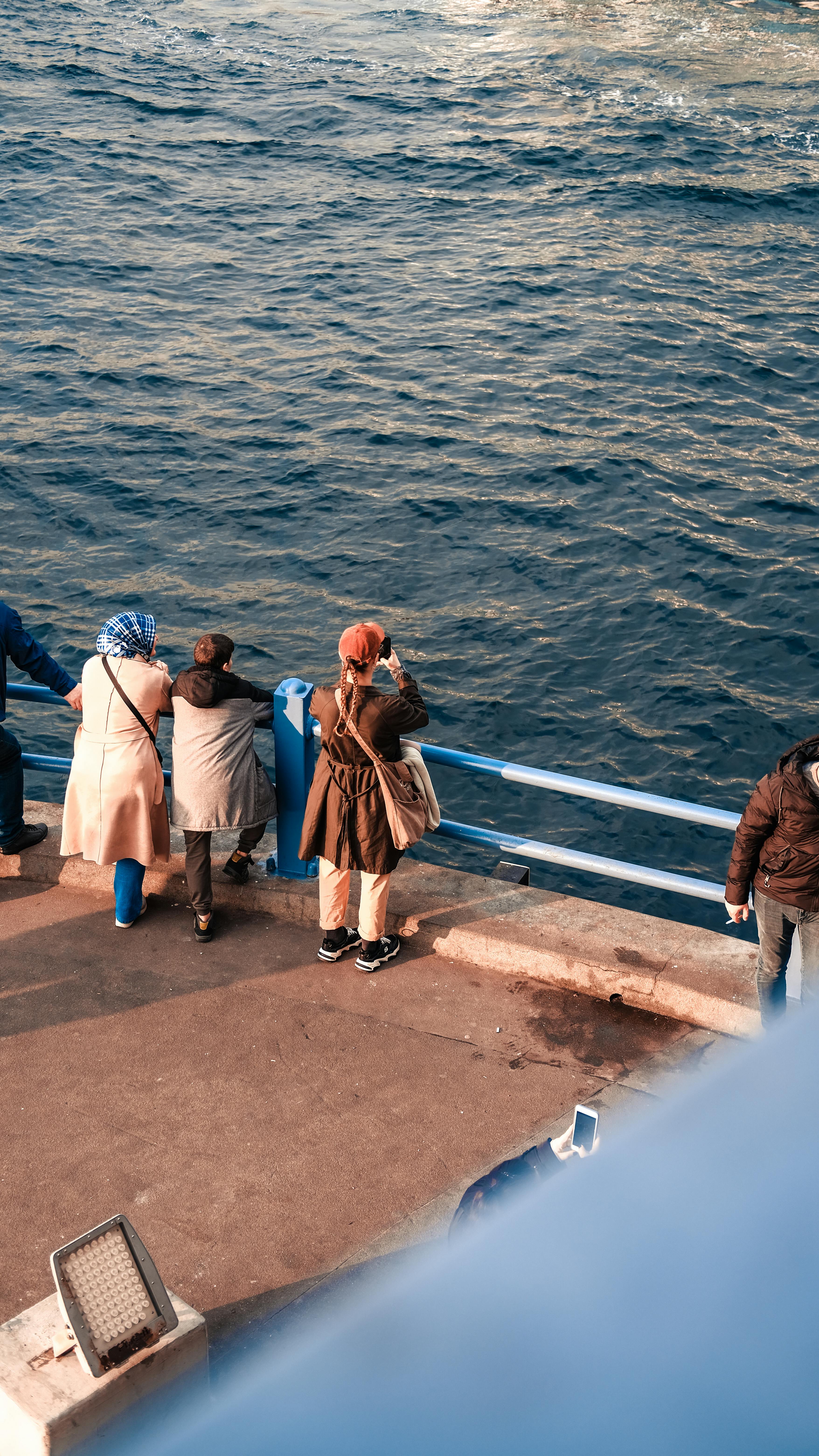 People Standing near Water · Free Stock Photo