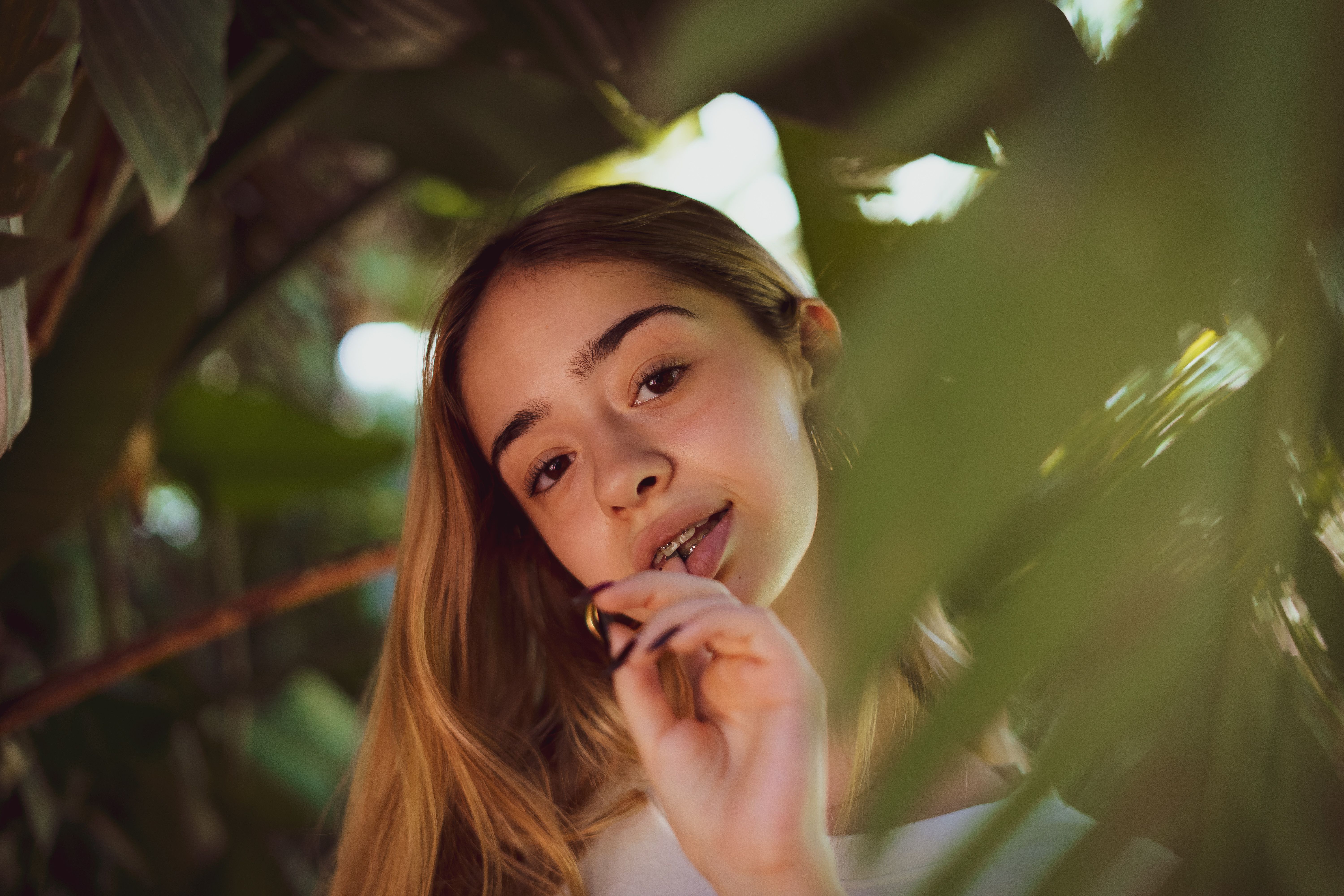 A Woman Biting her Finger · Free Stock Photo
