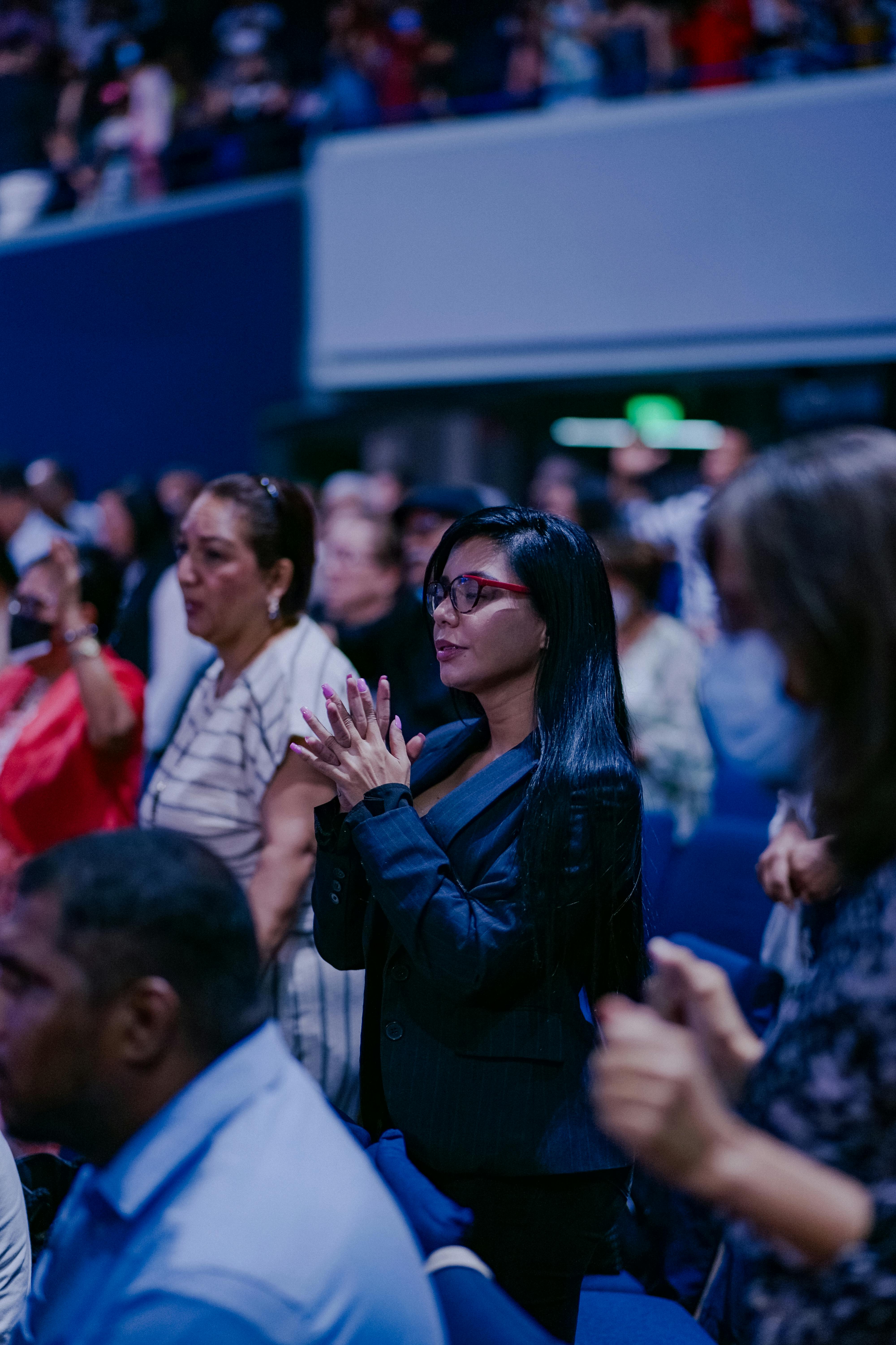 Woman Praying on Gathering · Free Stock Photo