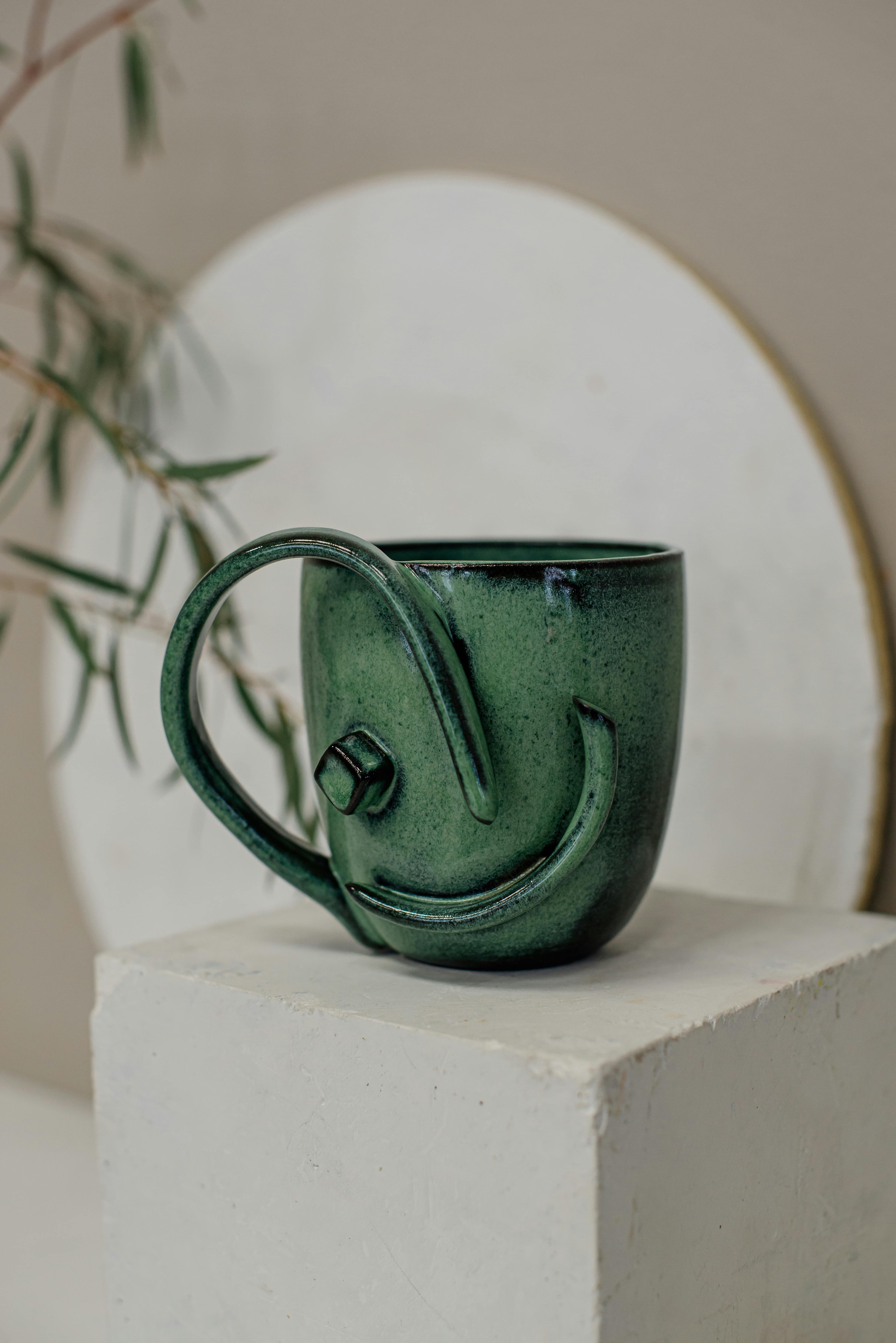 Green Cup in a Studio · Free Stock Photo