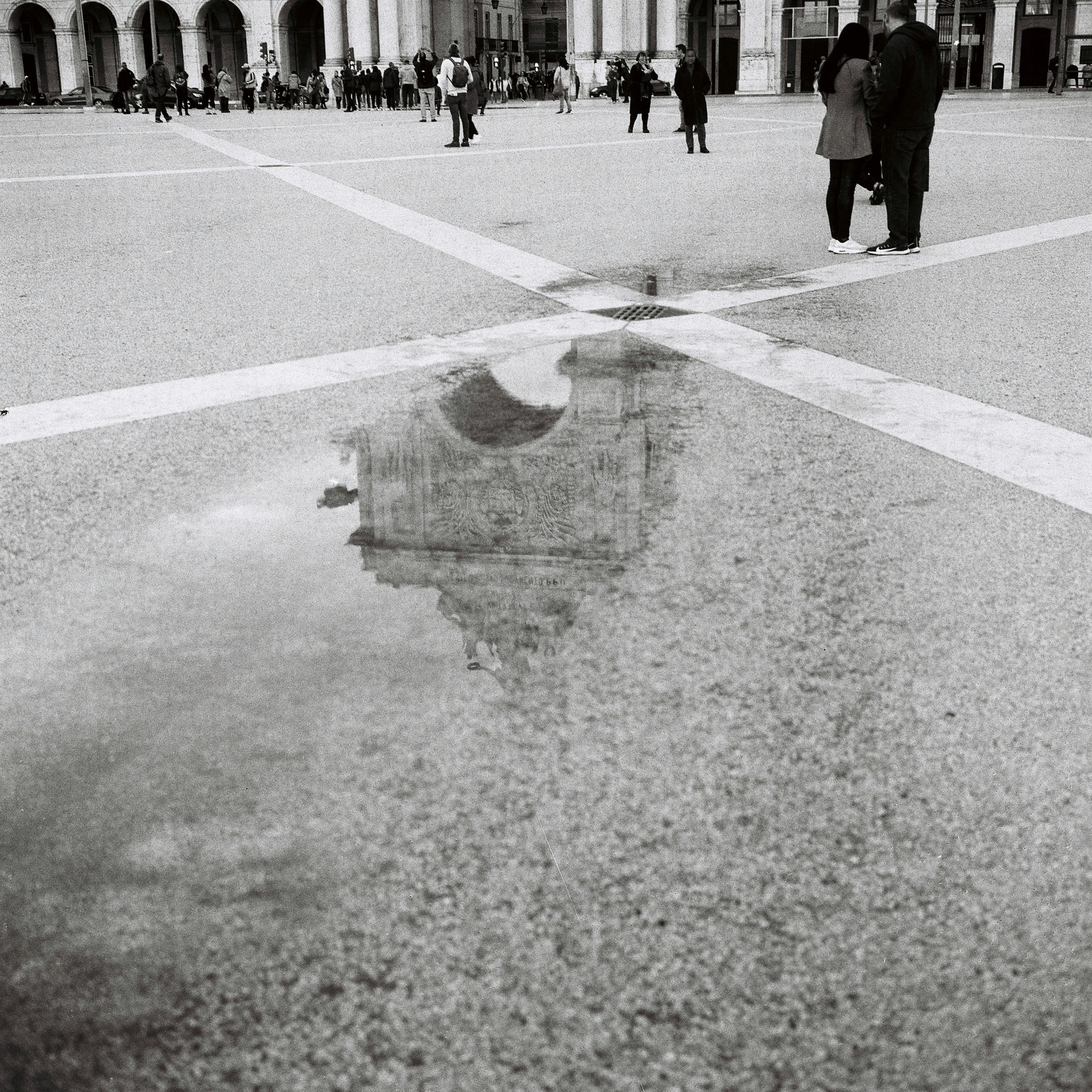 Monochrome Shot of a Puddle on the Ground · Free Stock Photo