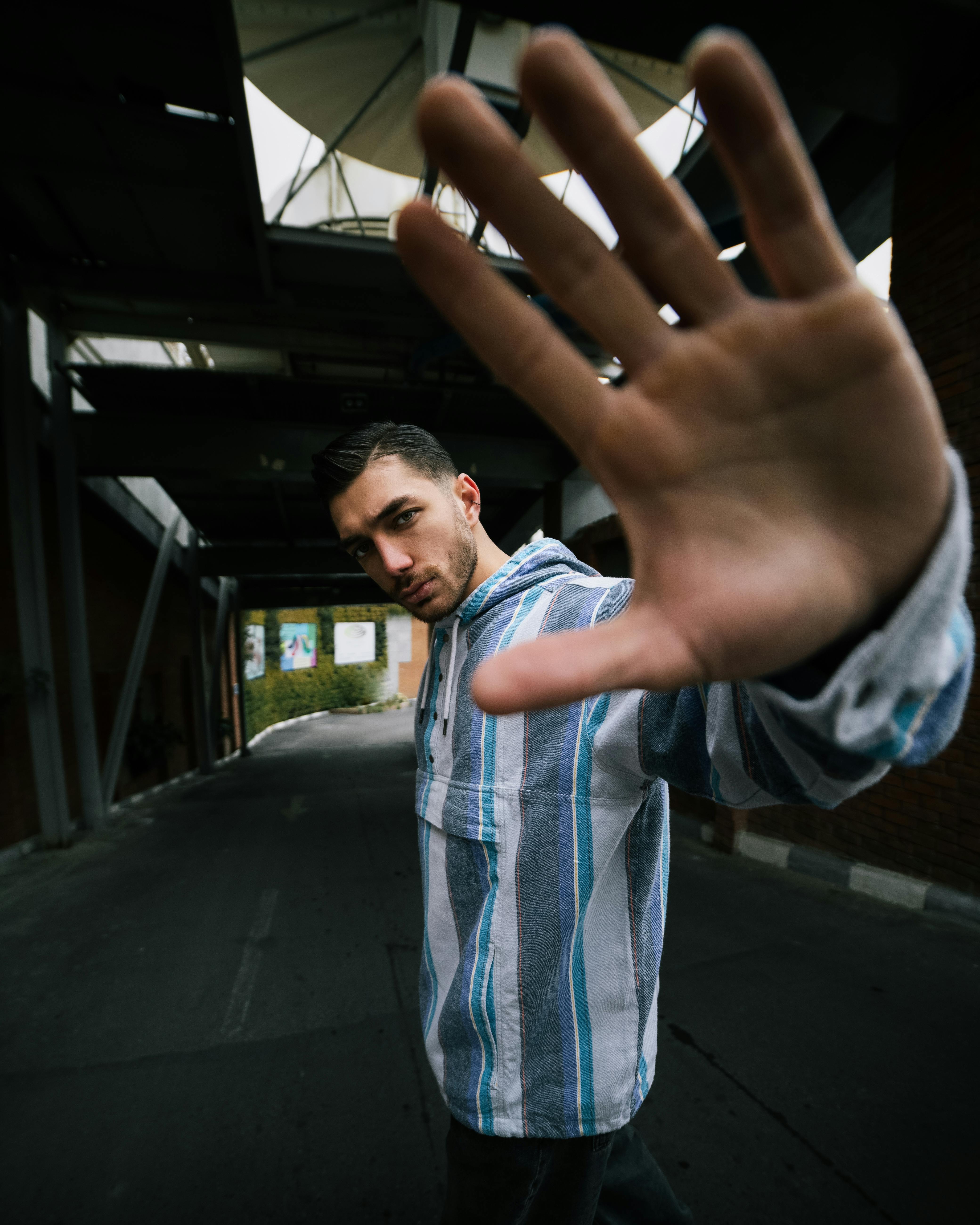 Young Man Stretching Hand to Camera · Free Stock Photo