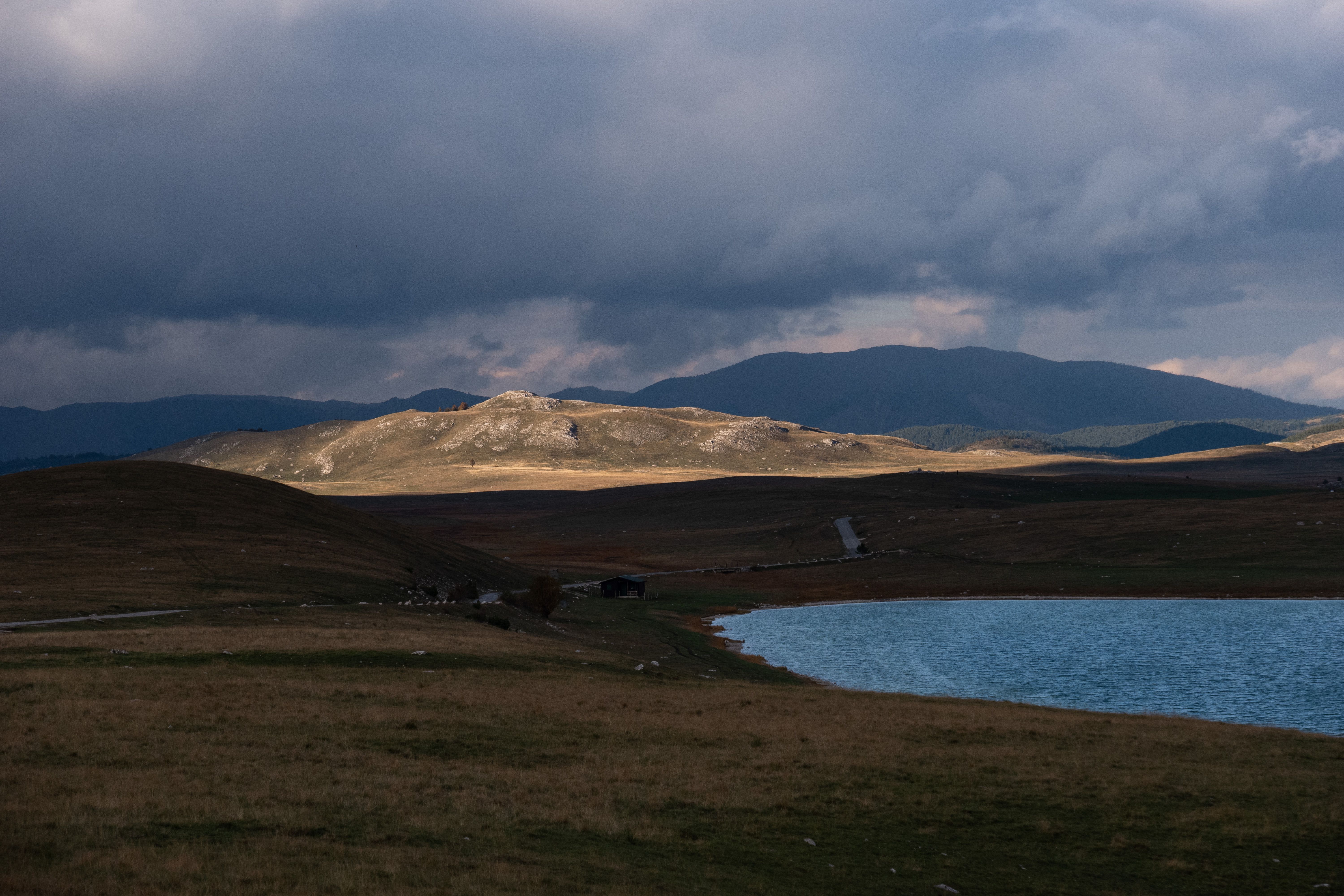 Clouds over Plains with Hills behind · Free Stock Photo