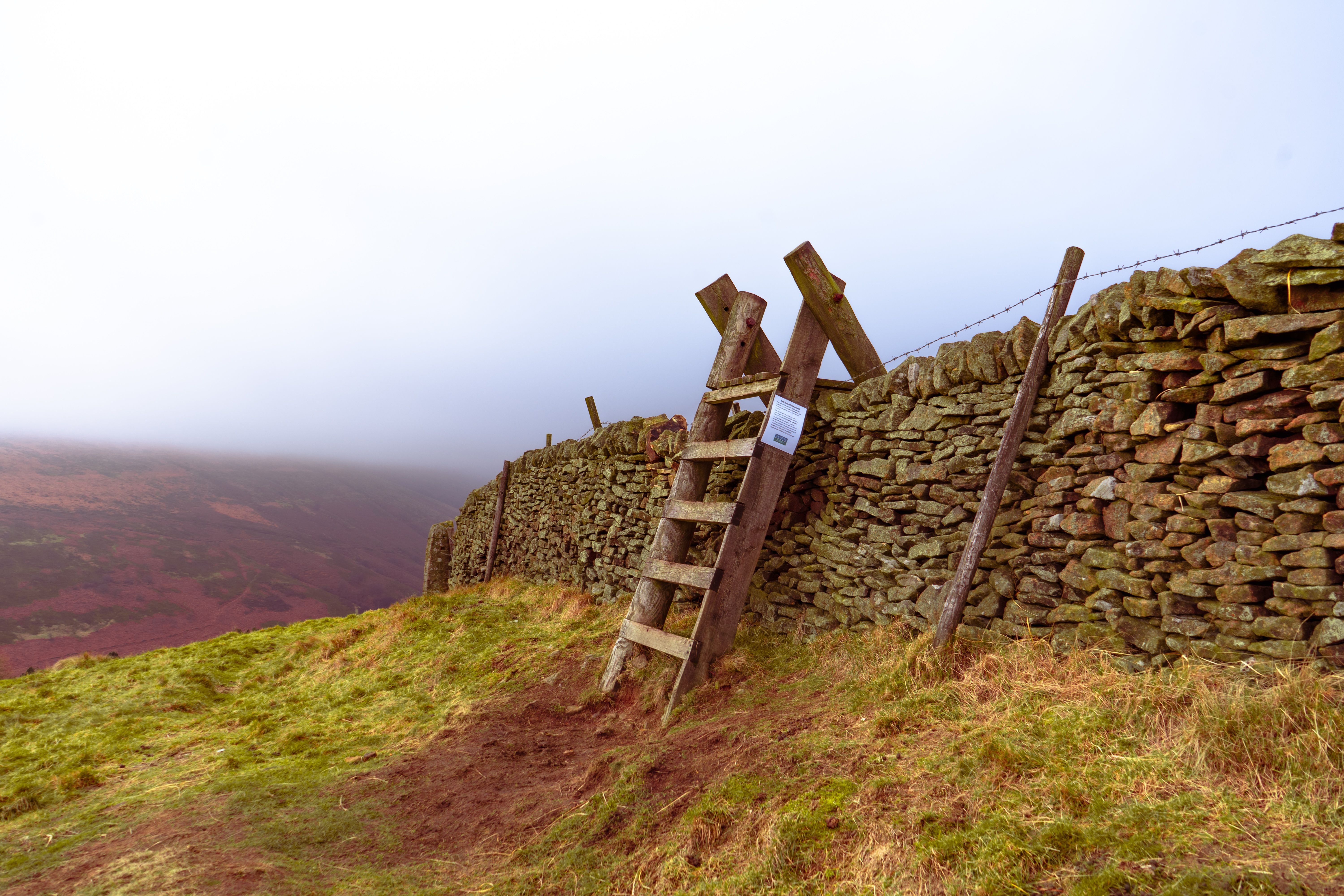 A Ladder over a Dry Stone Wall in Hills · Free Stock Photo