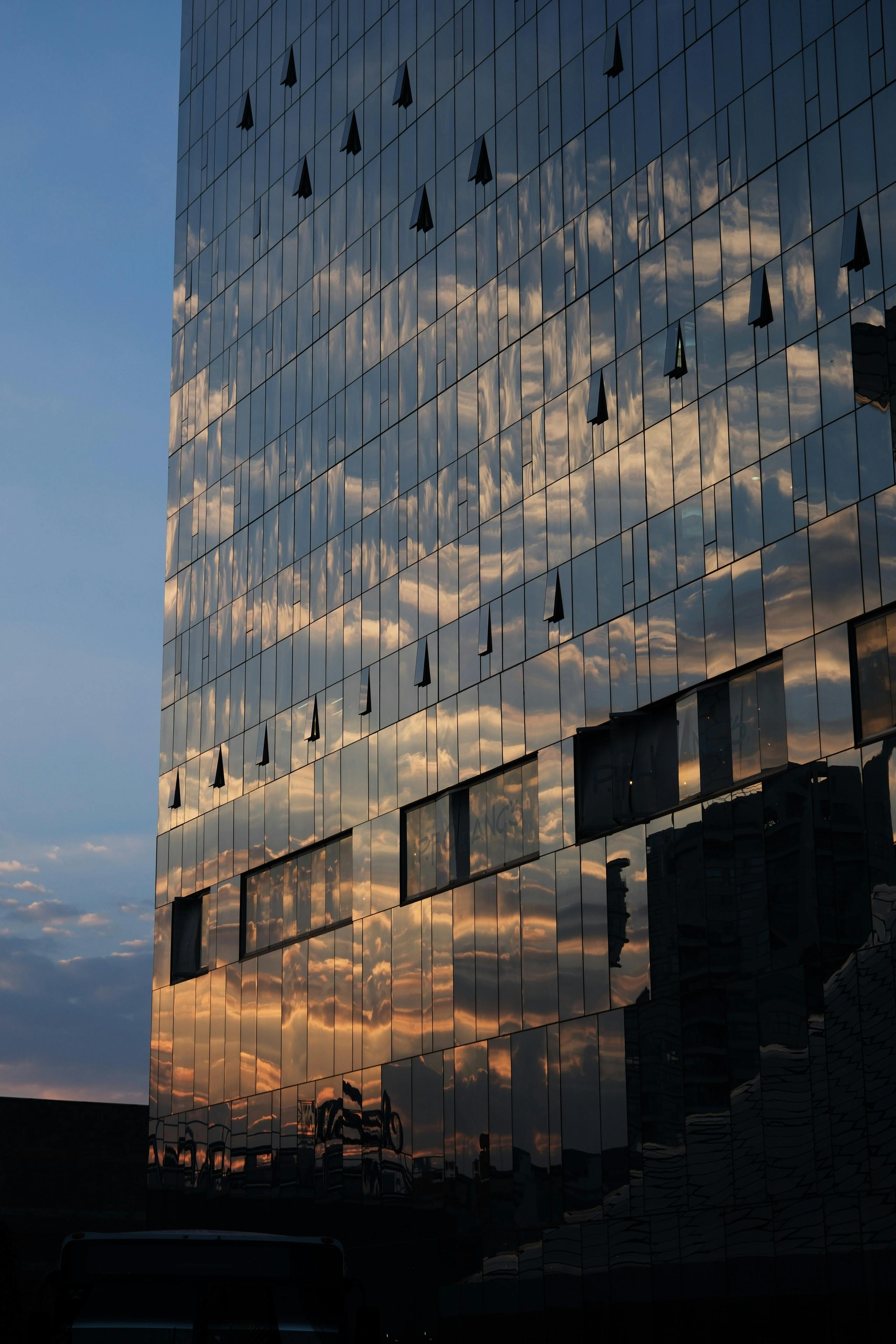 A Building with Glass Panels · Free Stock Photo