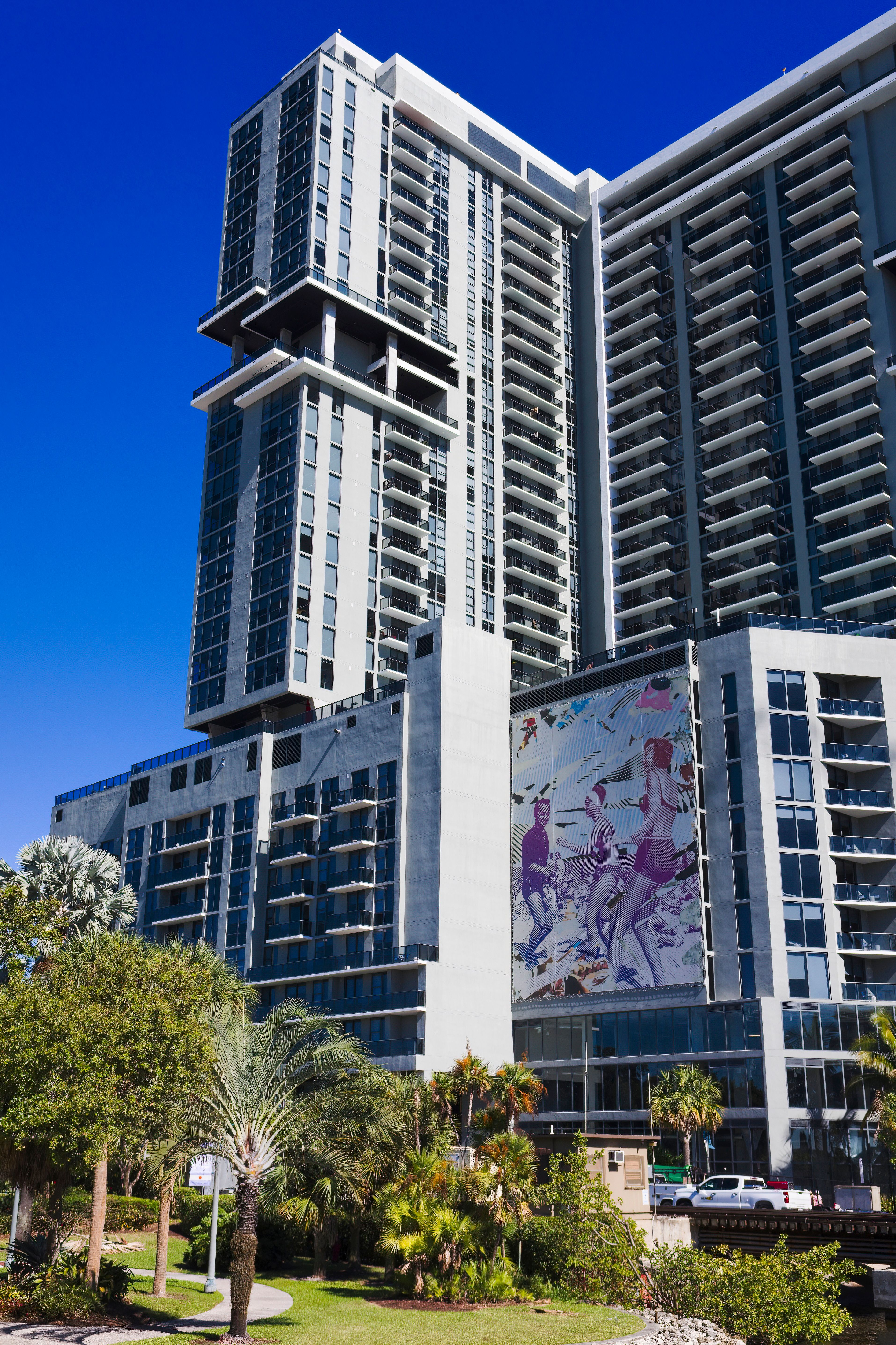 An Apartment Skyscraper in City under Blue Sky · Free Stock Photo