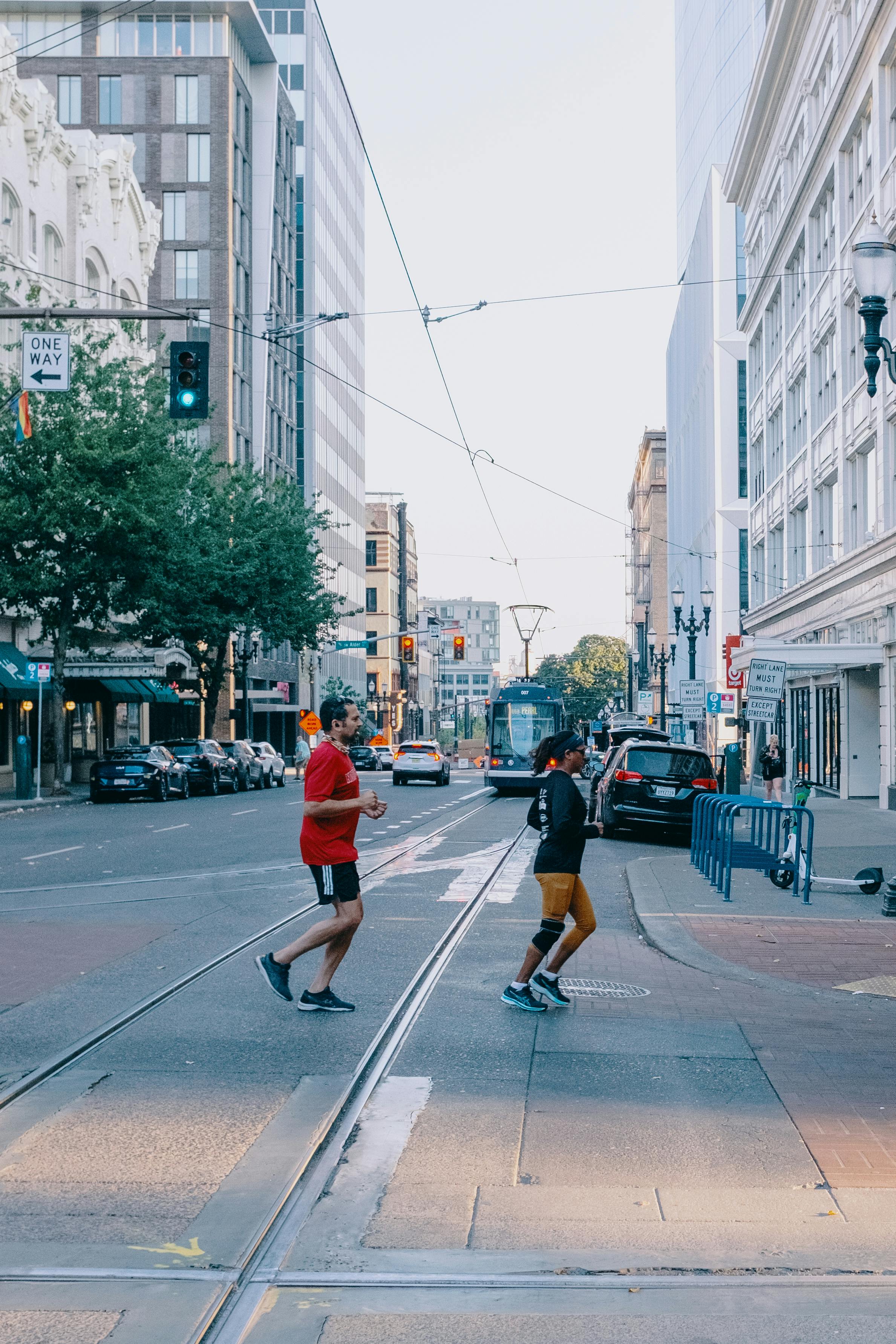 Man and Woman Jogging in City · Free Stock Photo