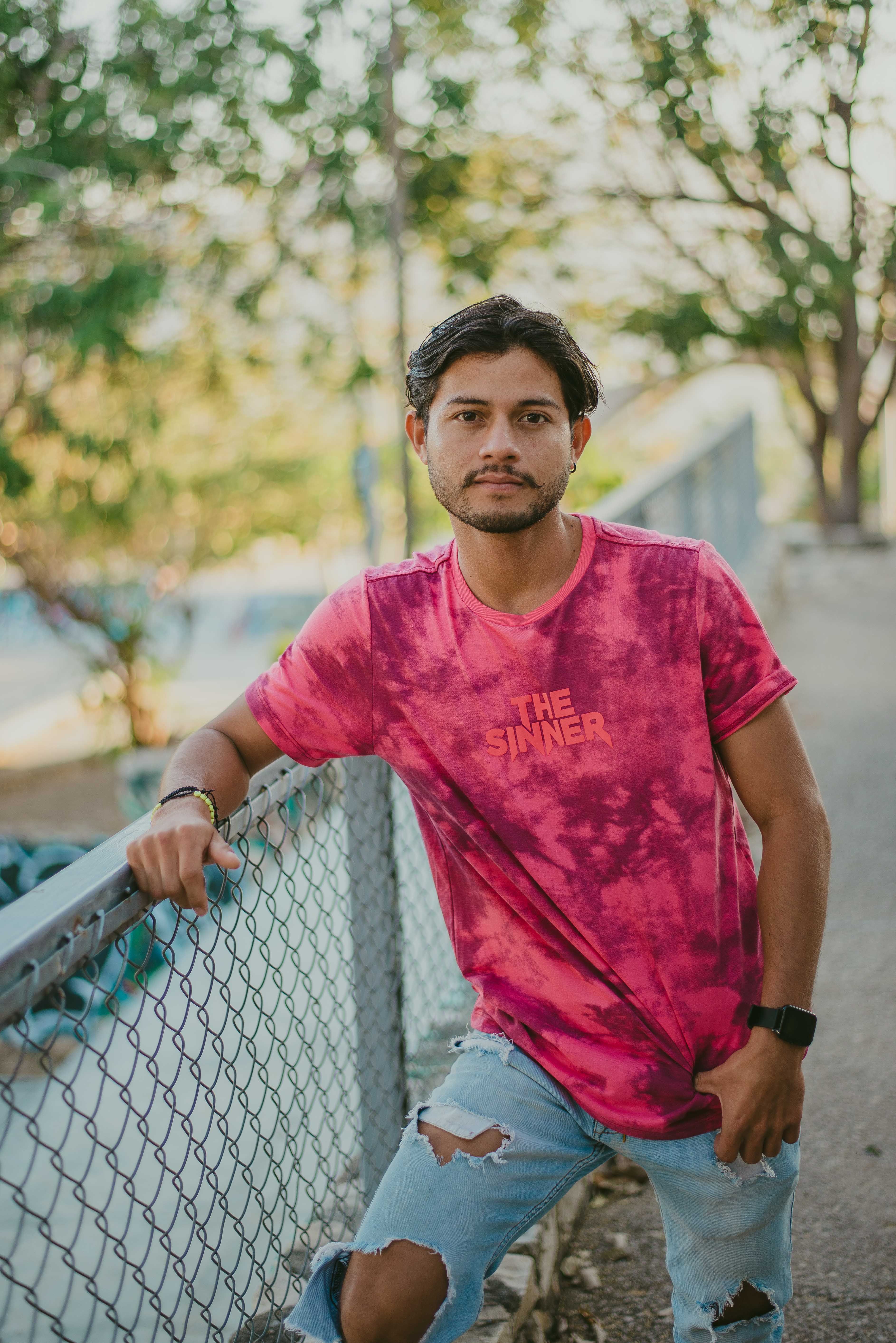 Young Man in Casual Clothing Standing Outdoors in Summer · Free Stock Photo