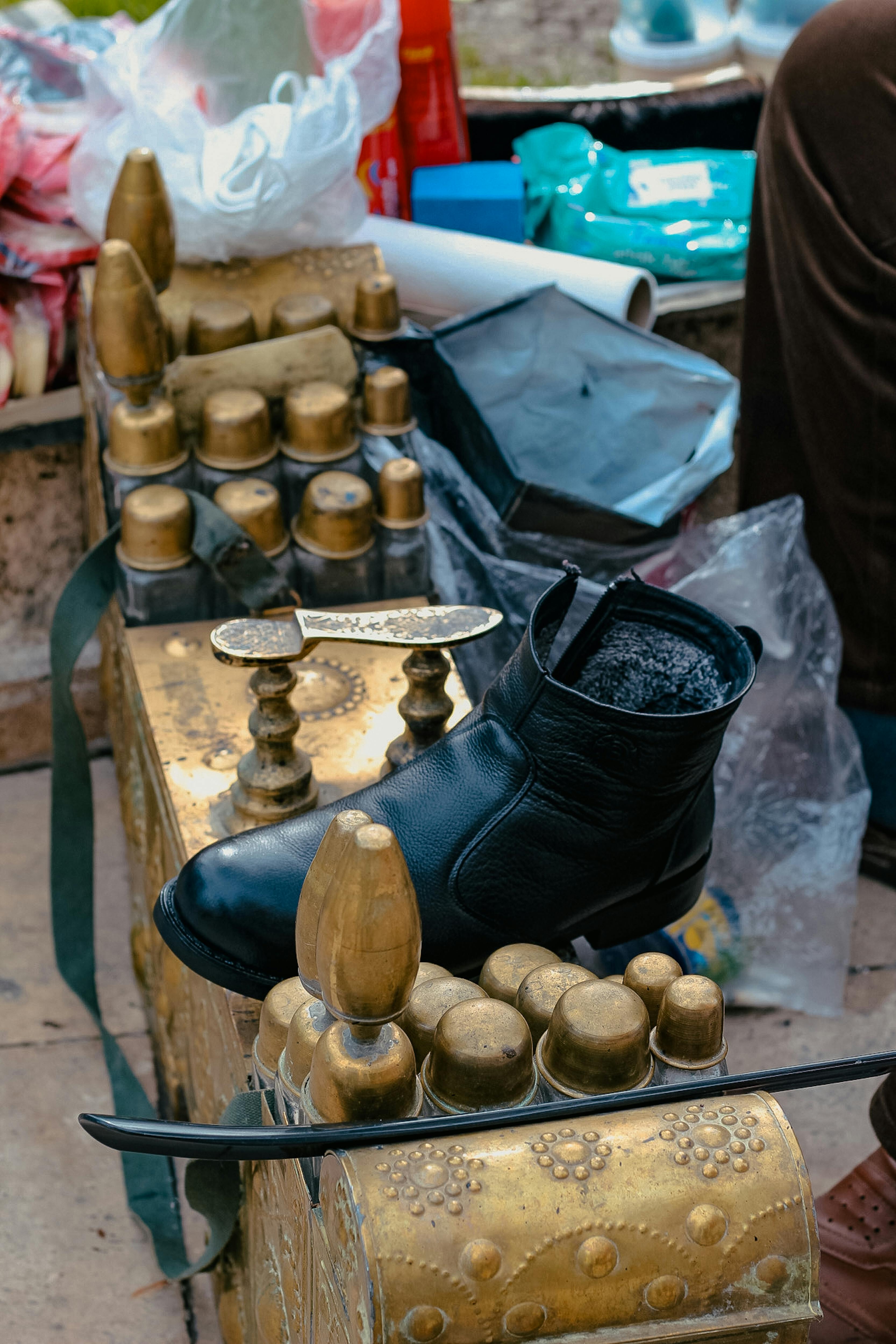 Shoe on Golden Bootblack Stand · Free Stock Photo