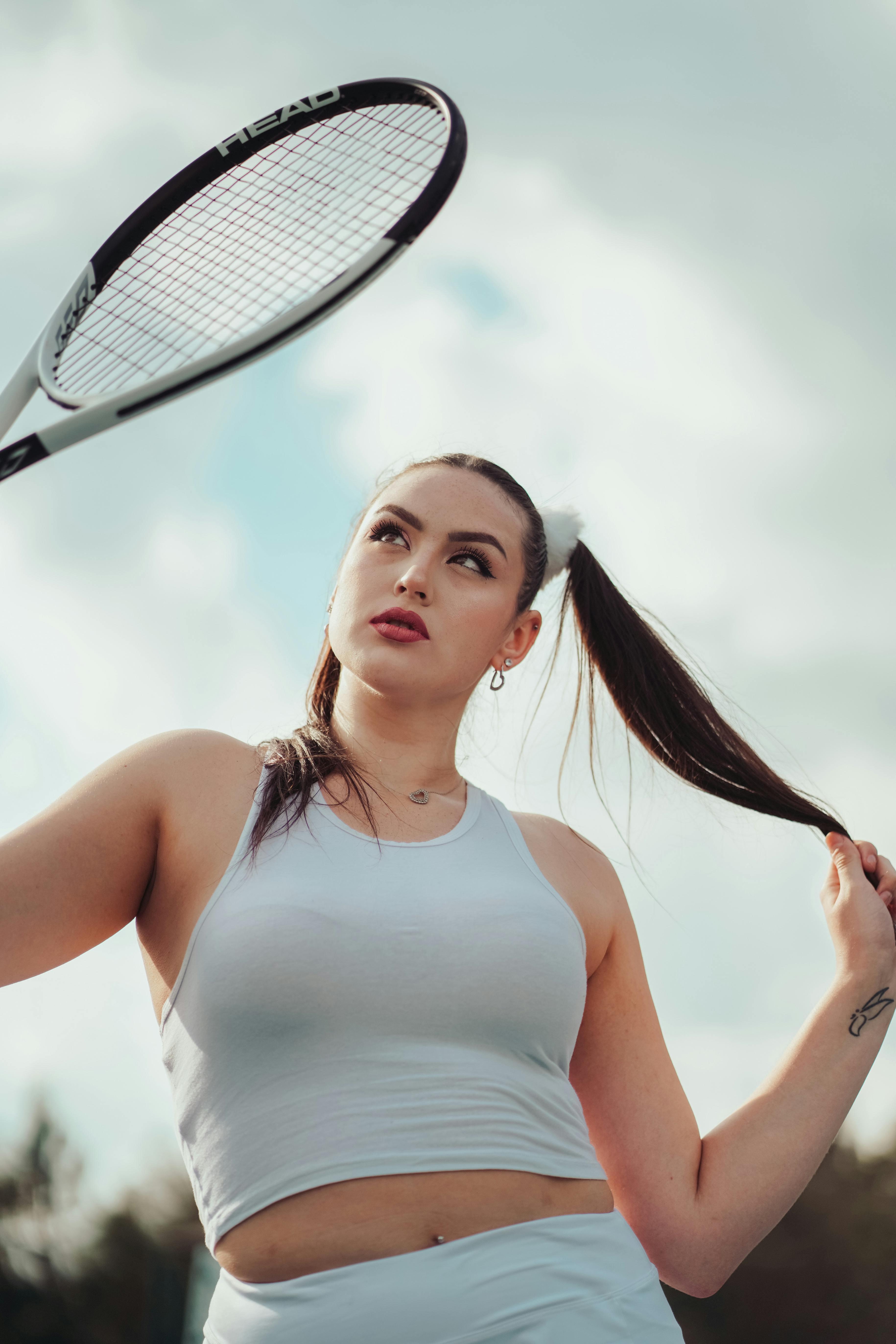 Brunette Woman with Racket · Free Stock Photo