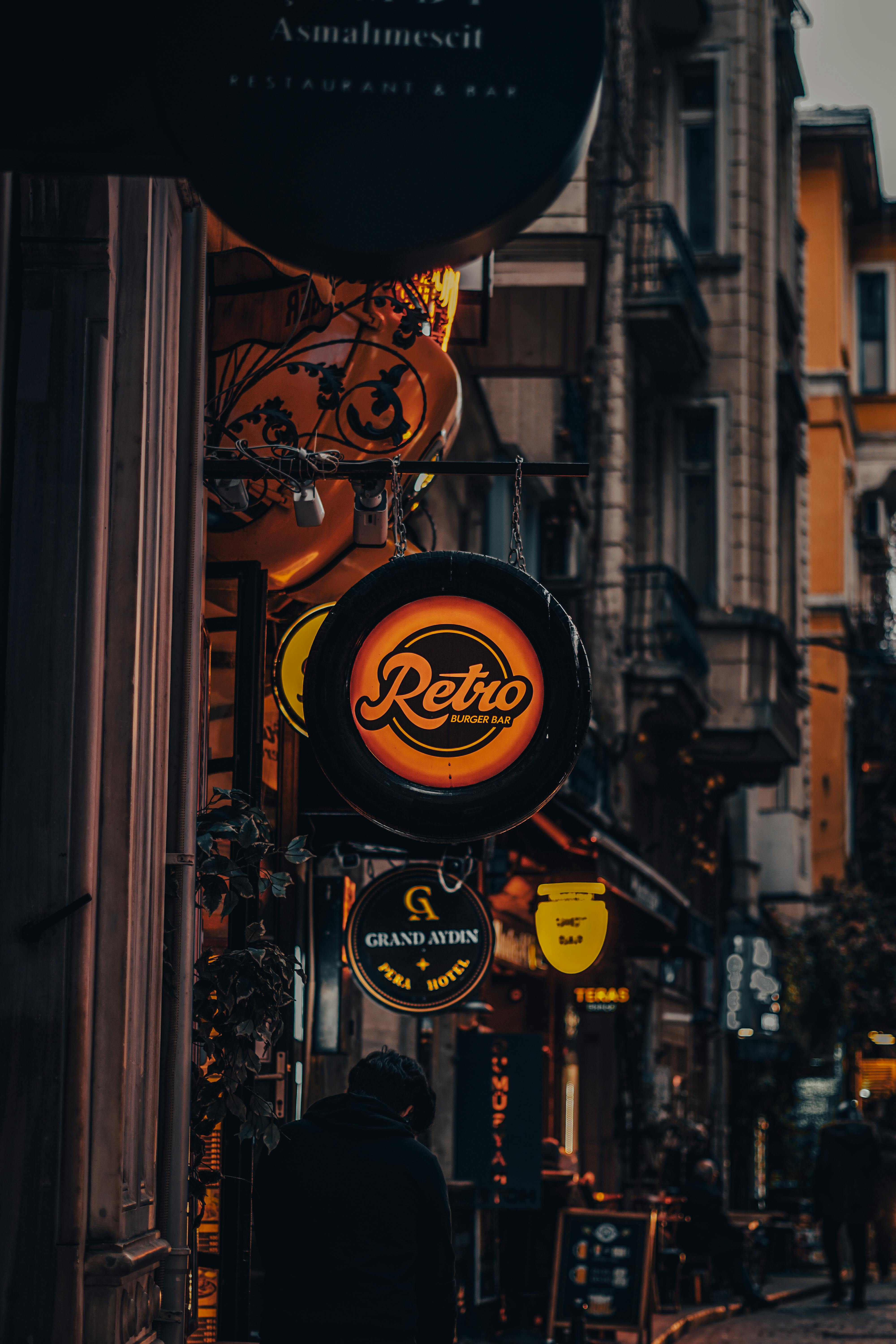 Neon Light Sign on the Side of a Building · Free Stock Photo