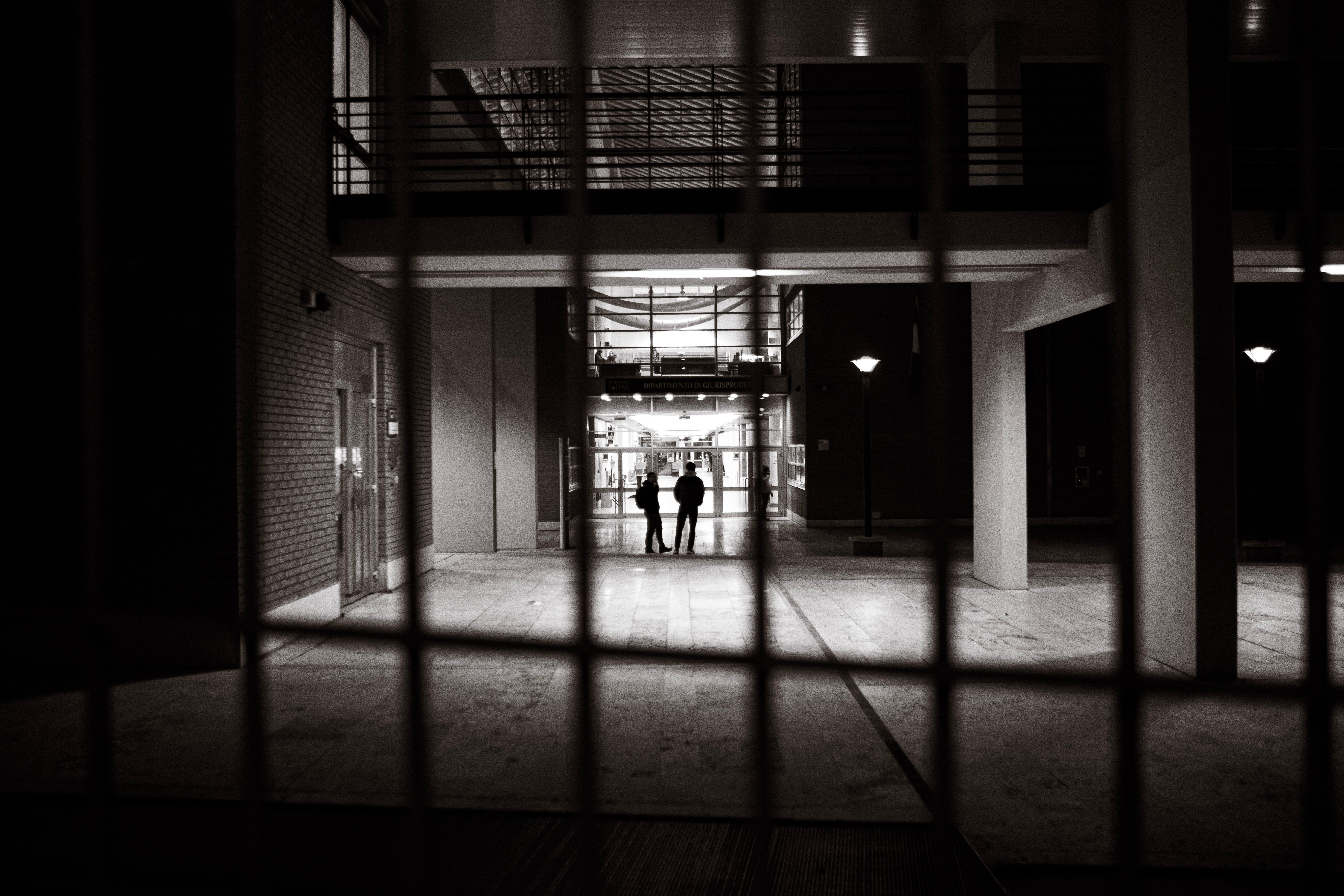 Silhouettes of People Standing in Hallway · Free Stock Photo