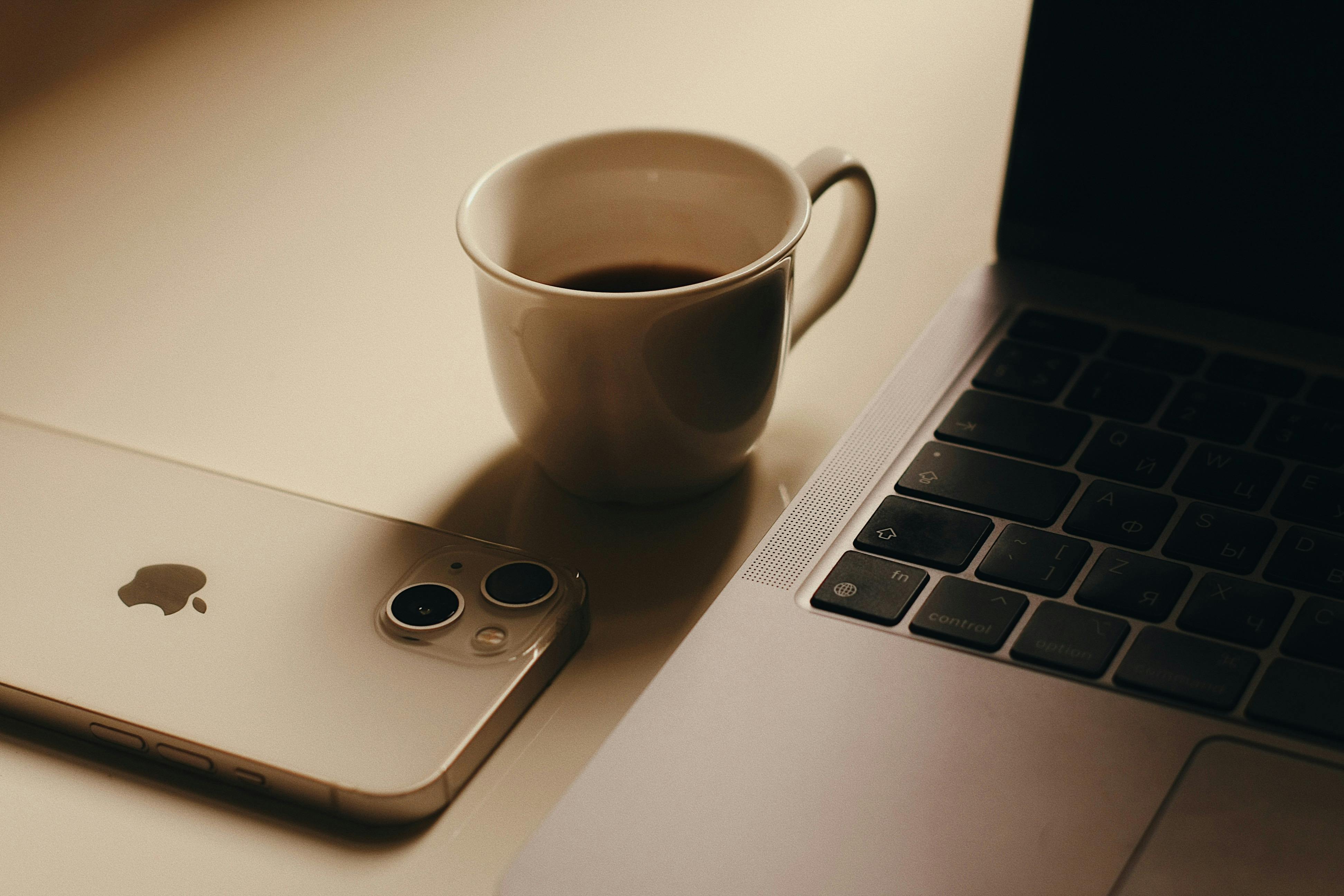 Cup, Laptop and iPhone · Free Stock Photo