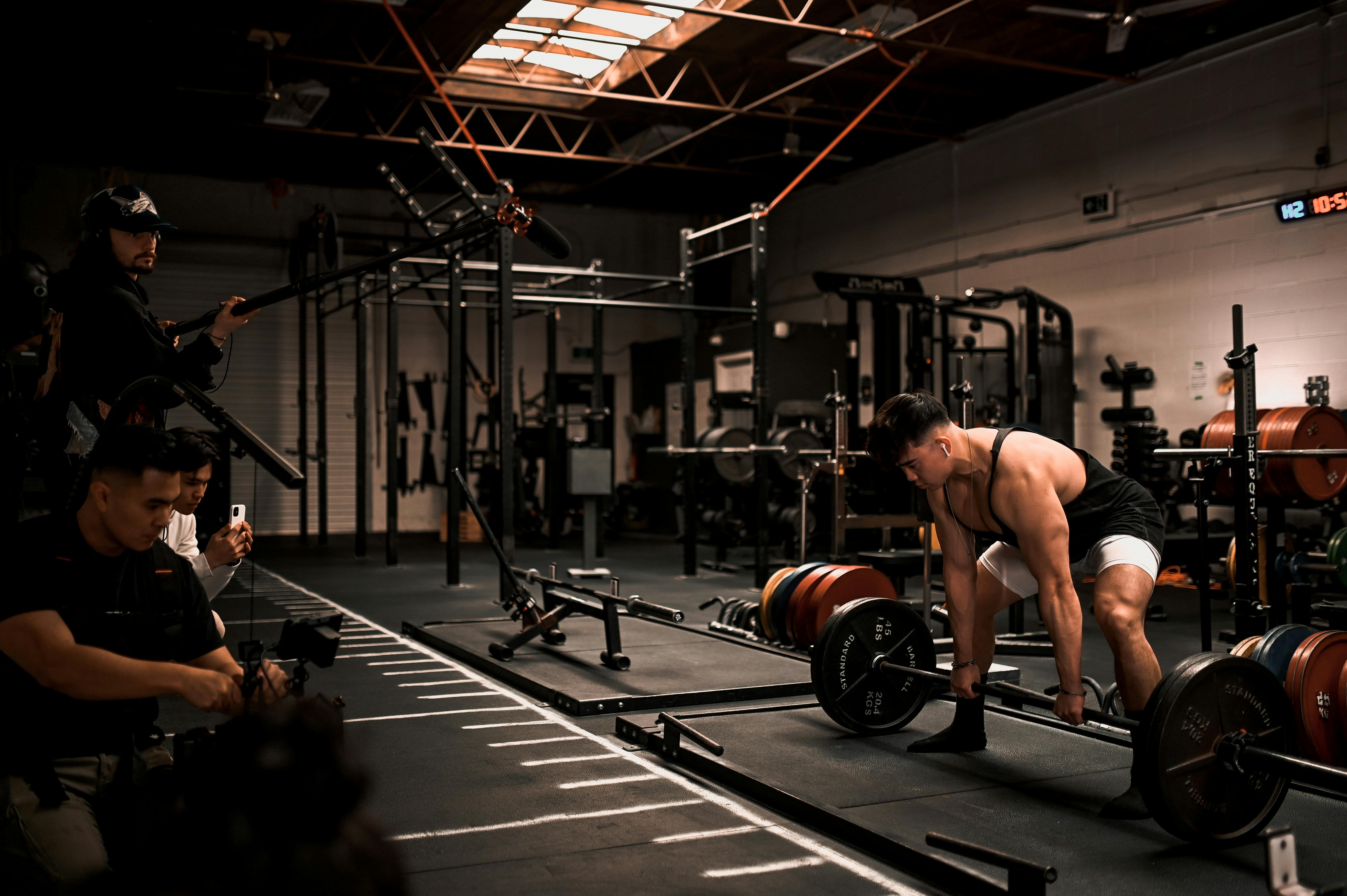 Men Filming Weightlifting at Gym · Free Stock Photo