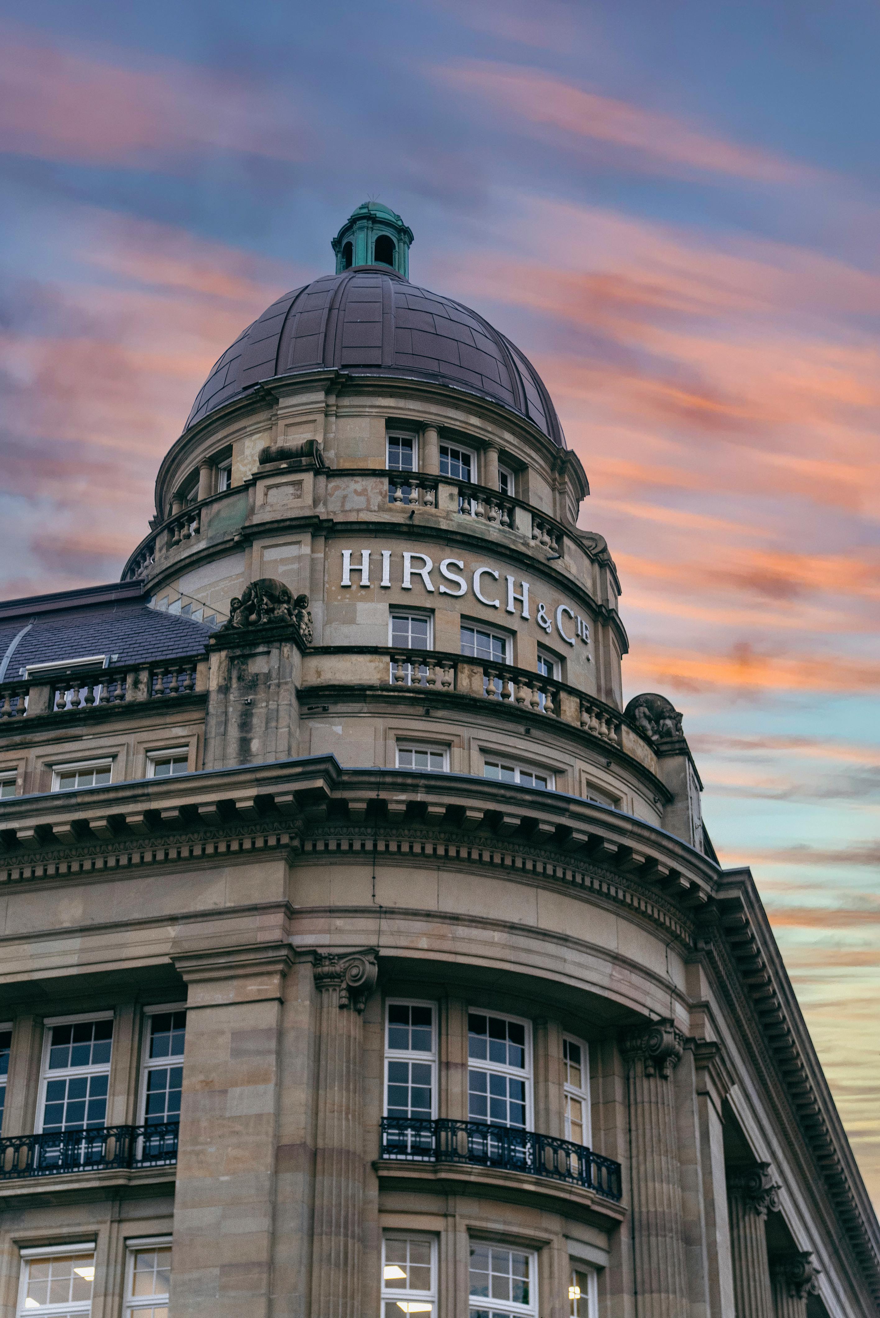 The Hirsch Building in Amsterdam Under Orange Sky · Free Stock Photo