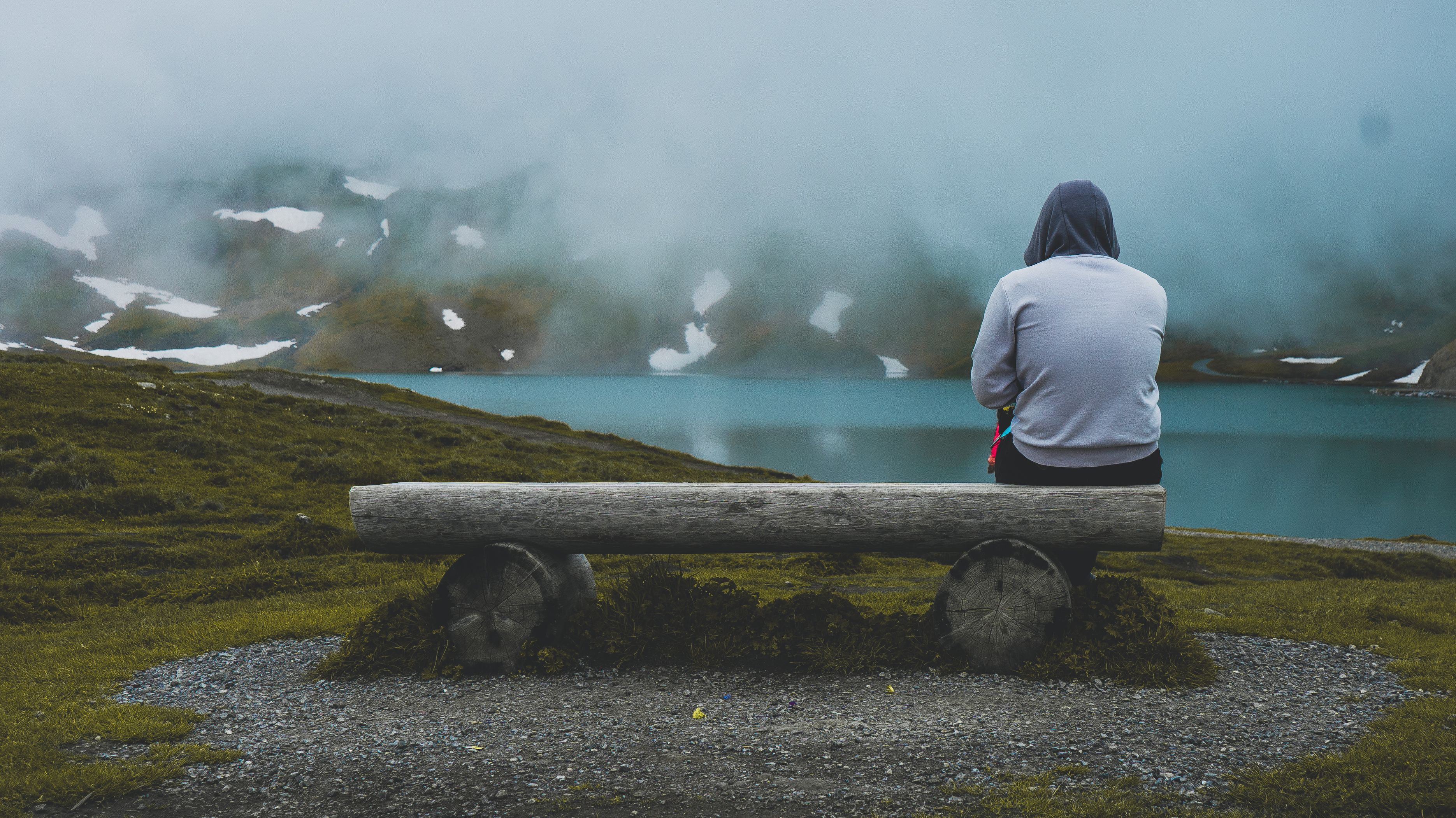 Photo of Person sitting on Wooden Bench · Free Stock Photo