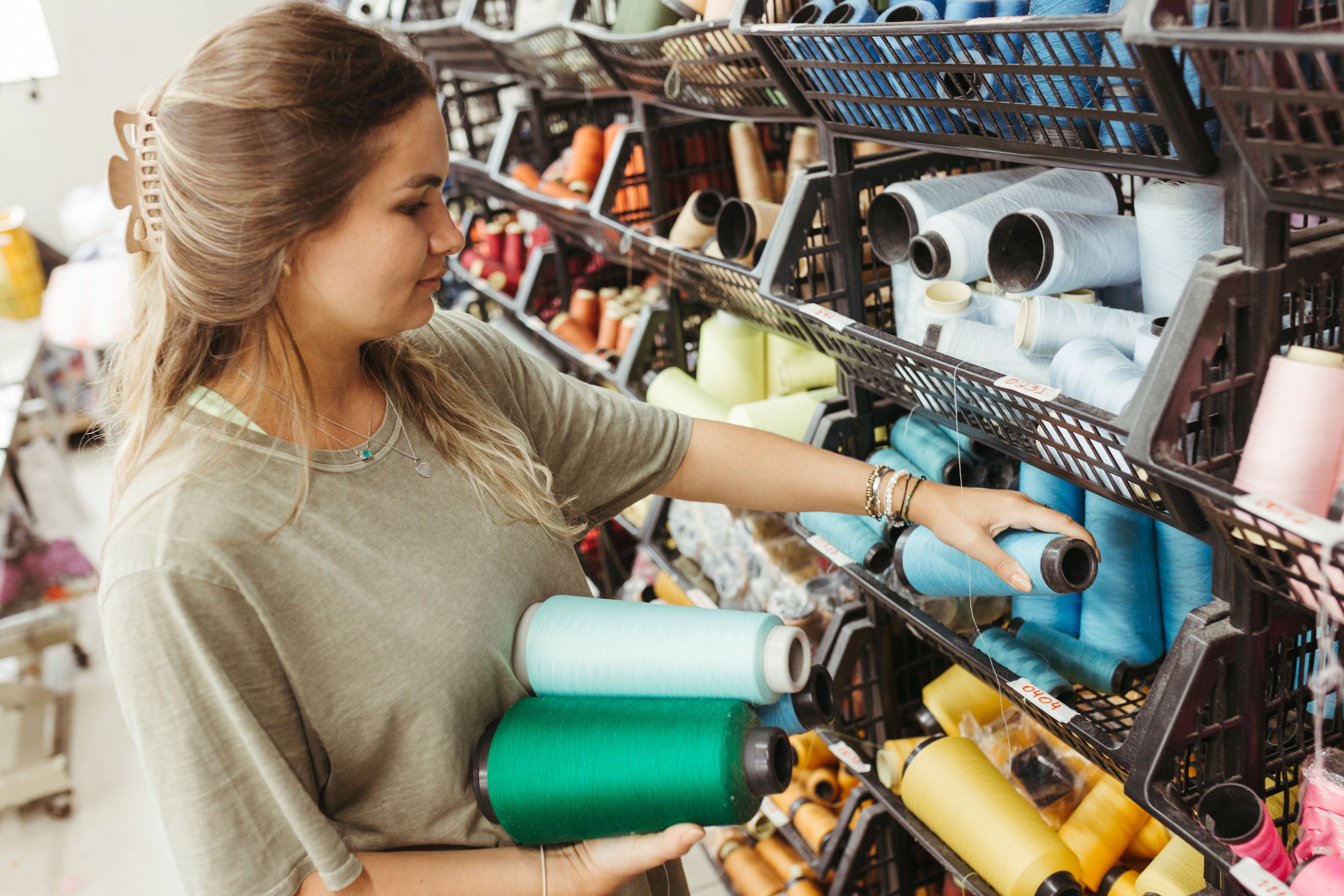People in Store with Colorful Threads · Free Stock Photo