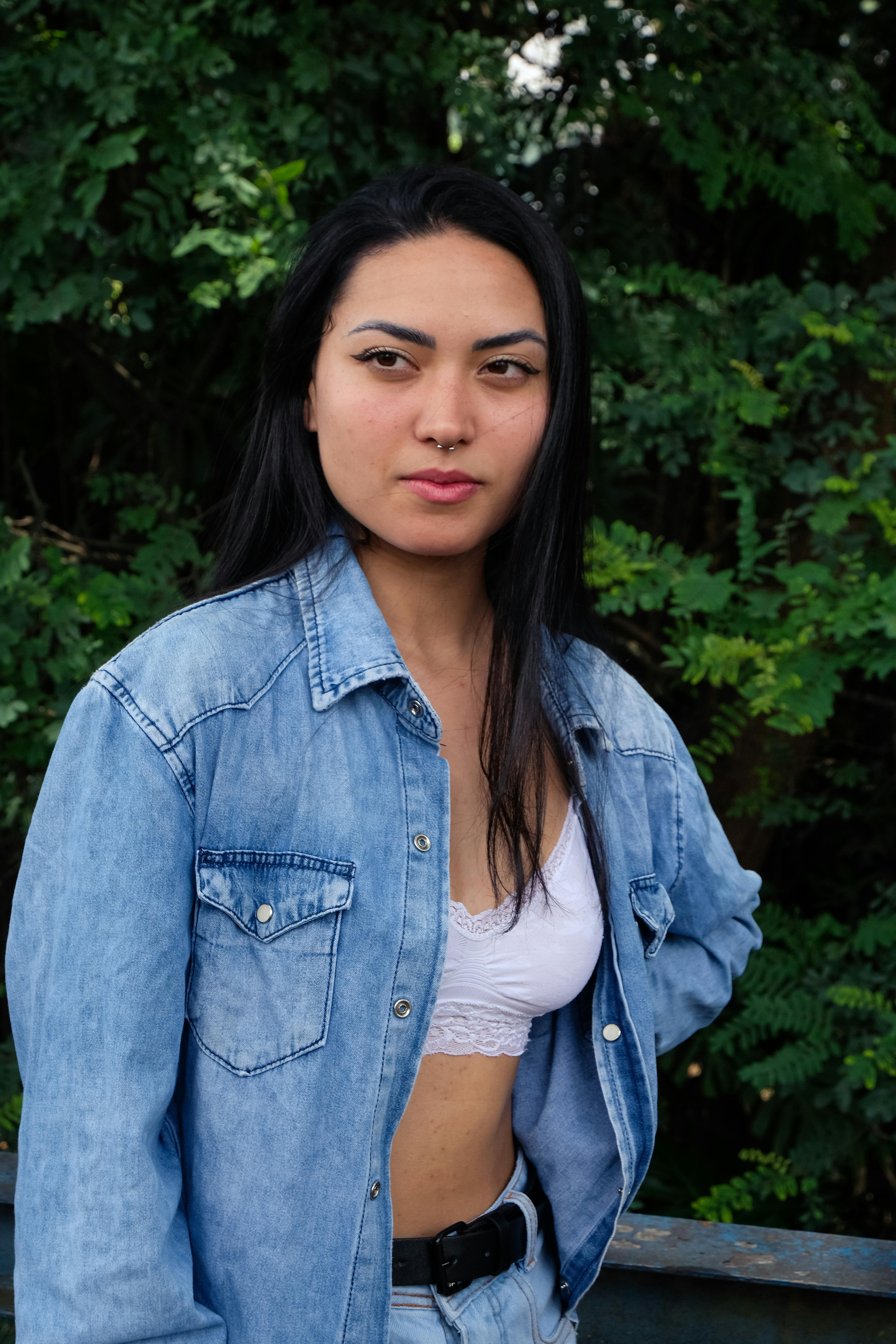 Woman in Unbuttoned Jean Shirt and White Crop Top · Free Stock Photo