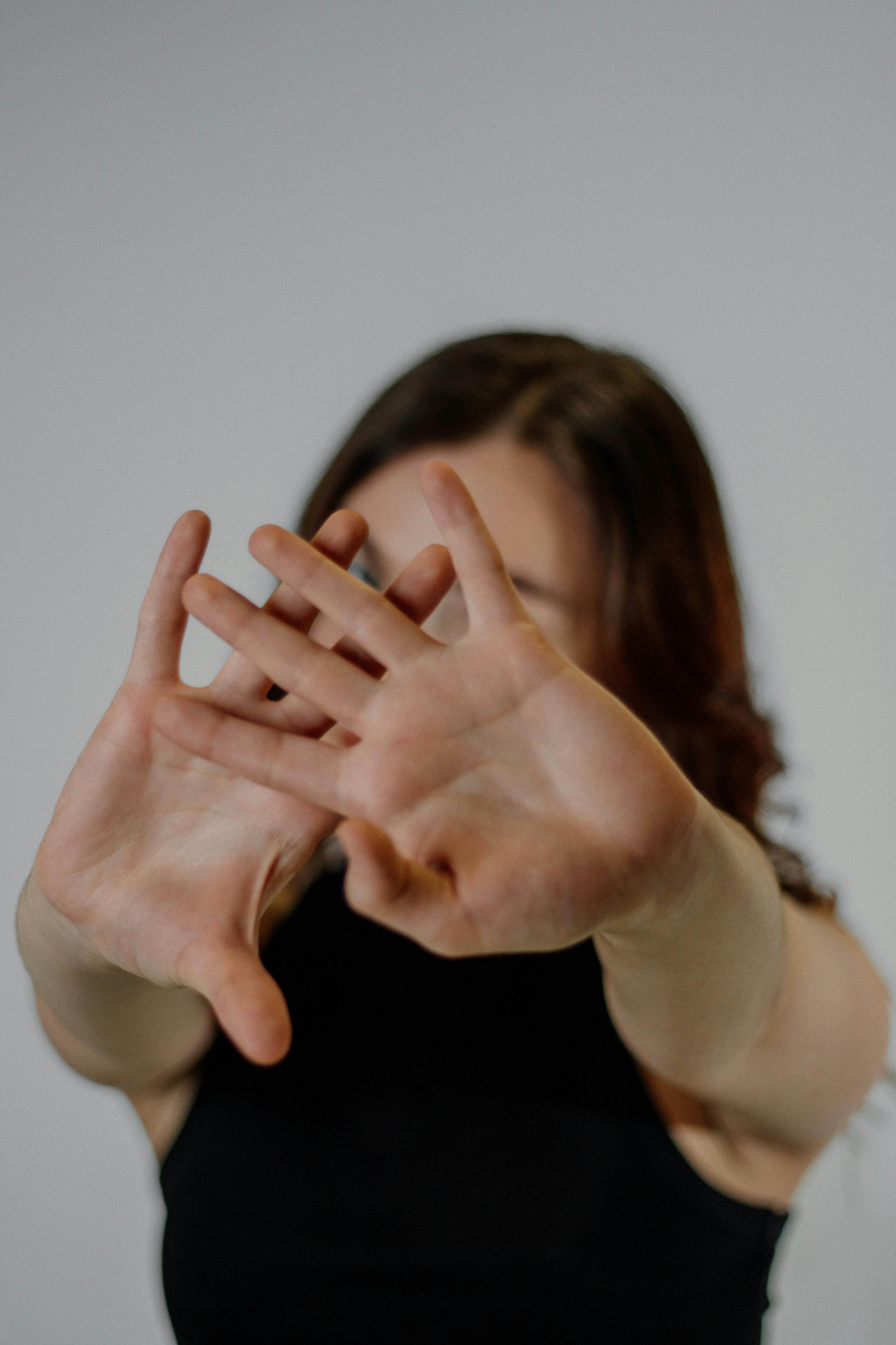 Grayscale Photo of Man Grabbing Using Right Hand · Free Stock Photo