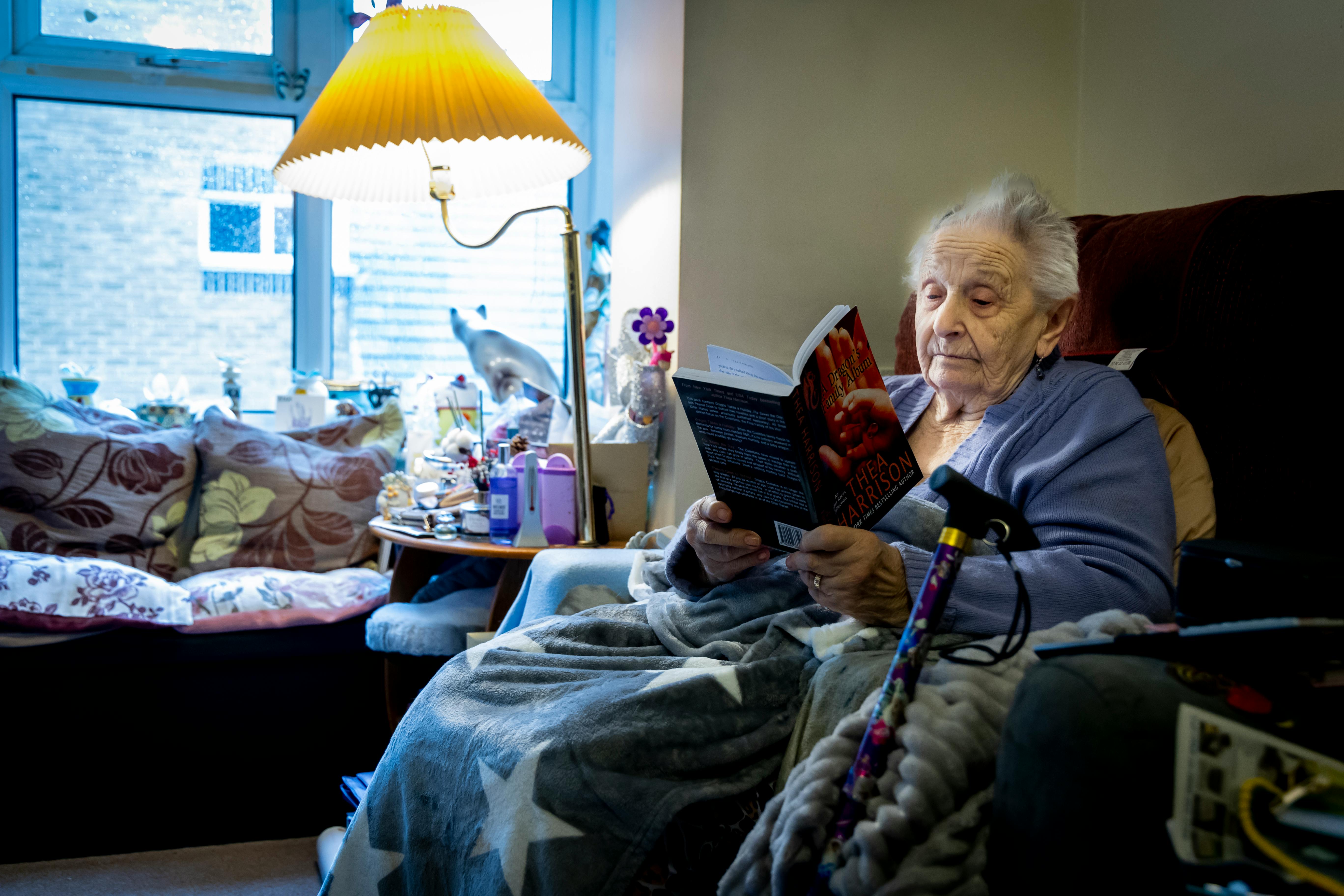 Elderly Woman Reading a Book · Free Stock Photo