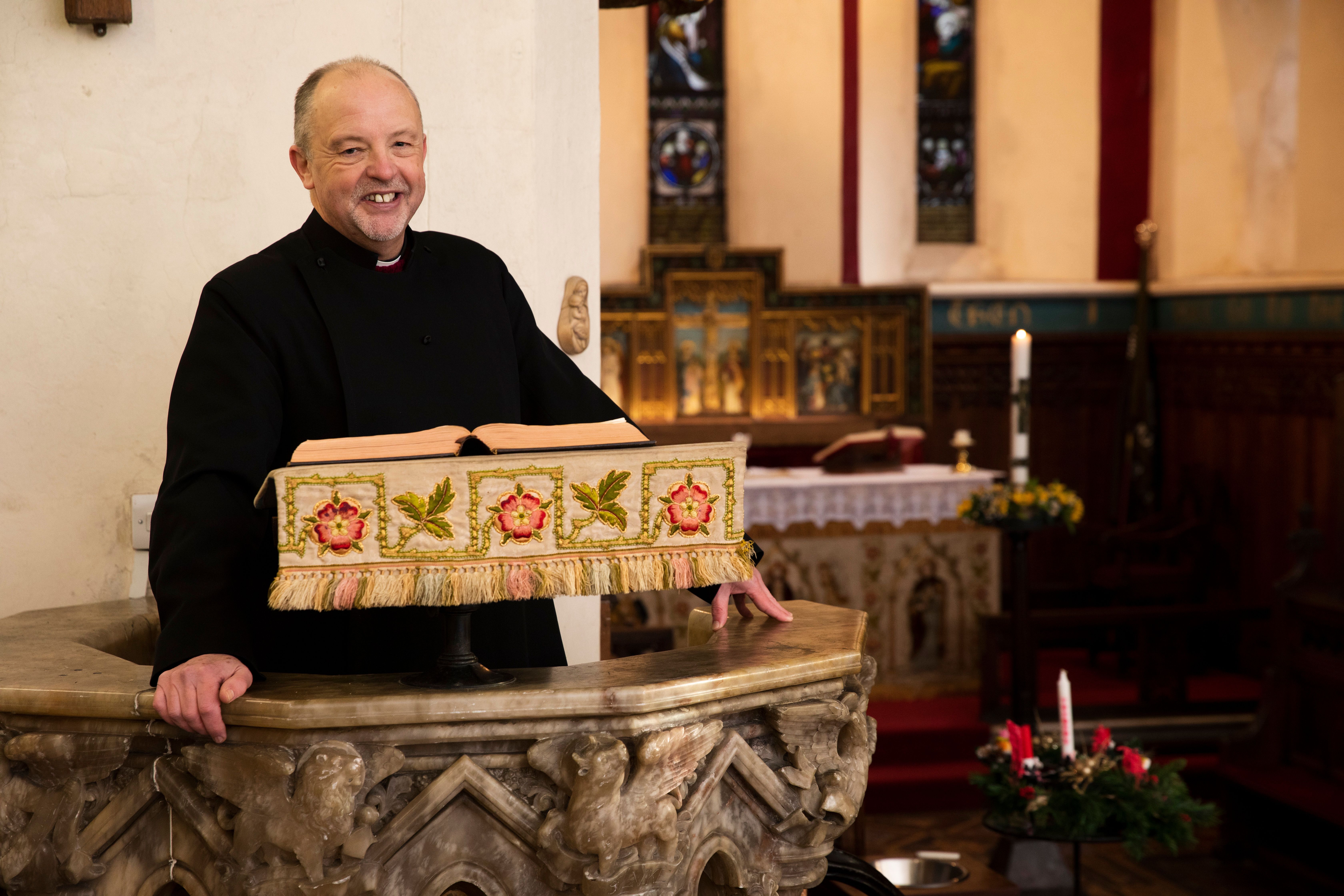 Smiling Priest Standing in Church · Free Stock Photo