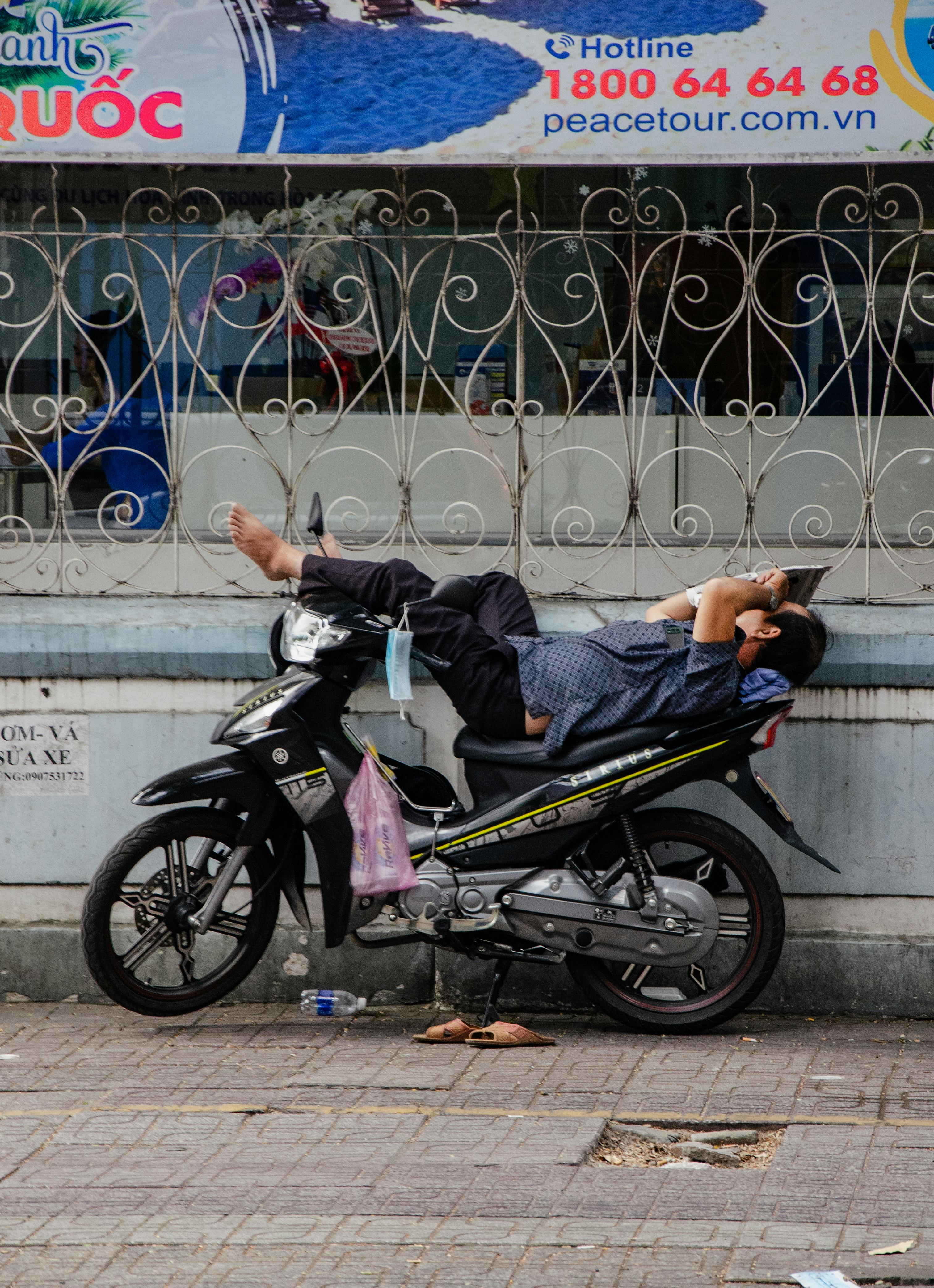 Man Lying on a Motorcycle · Free Stock Photo