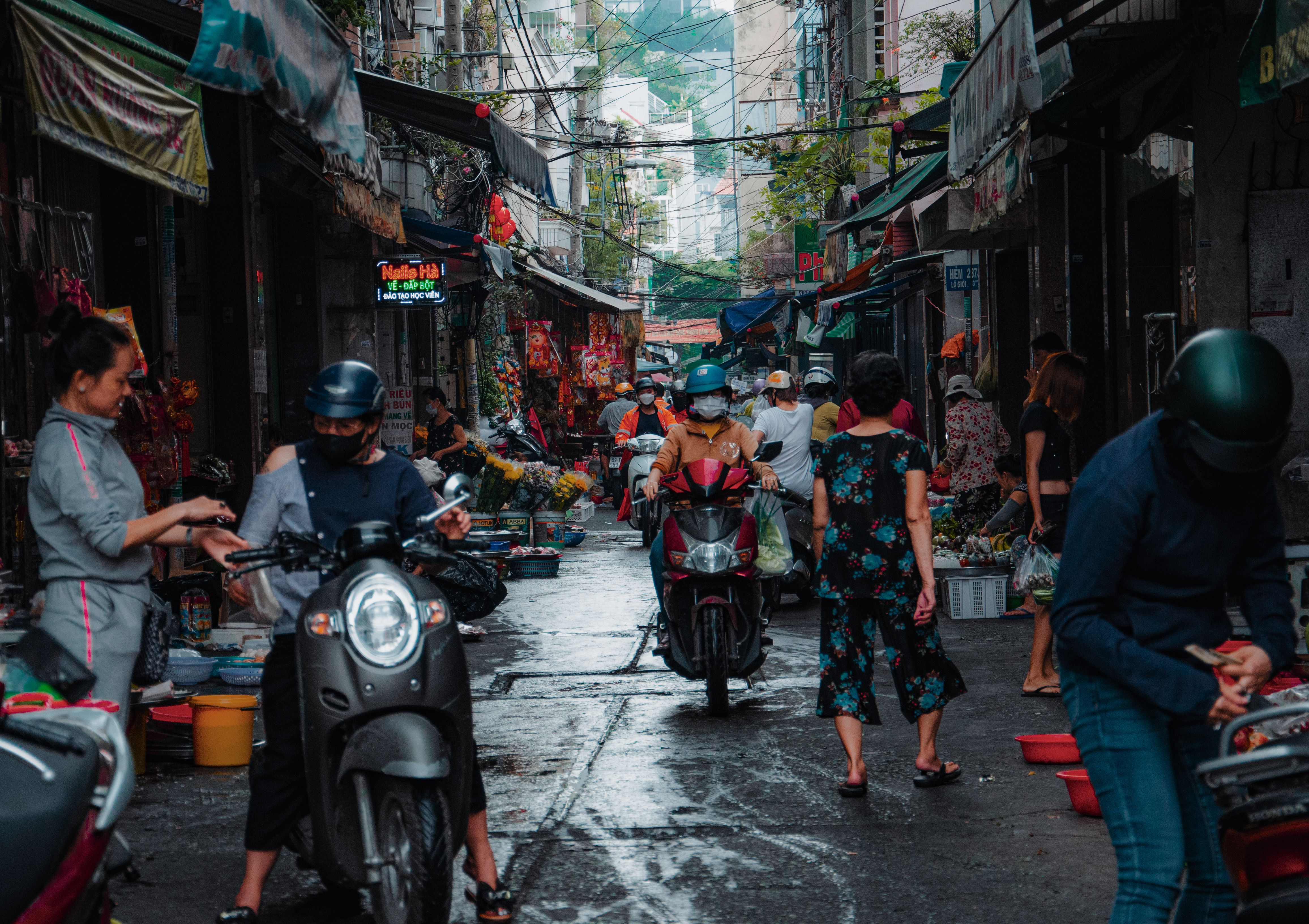 People and Scooters on Crowded Street · Free Stock Photo