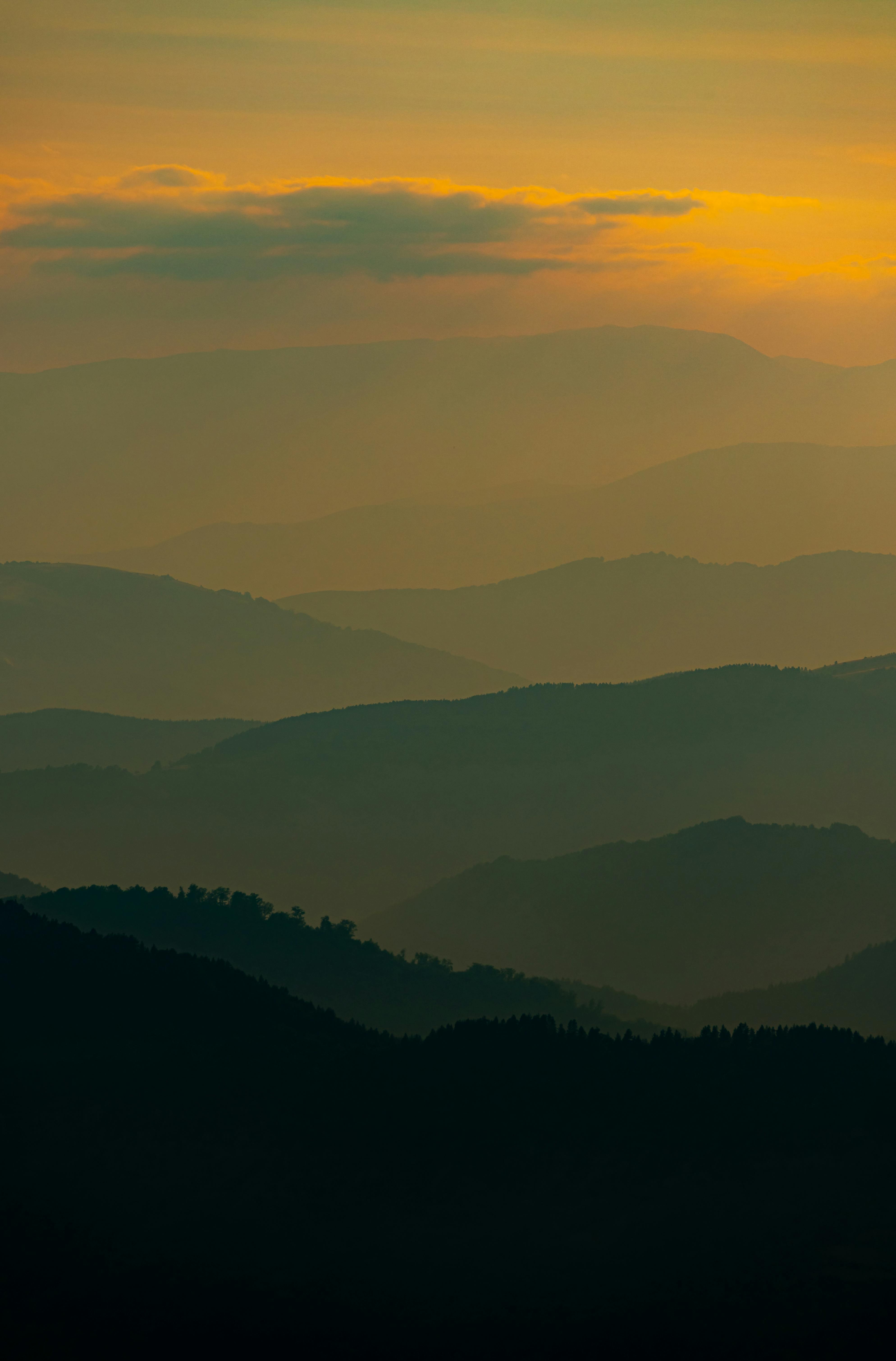 Mountain Ranges during Dusk · Free Stock Photo