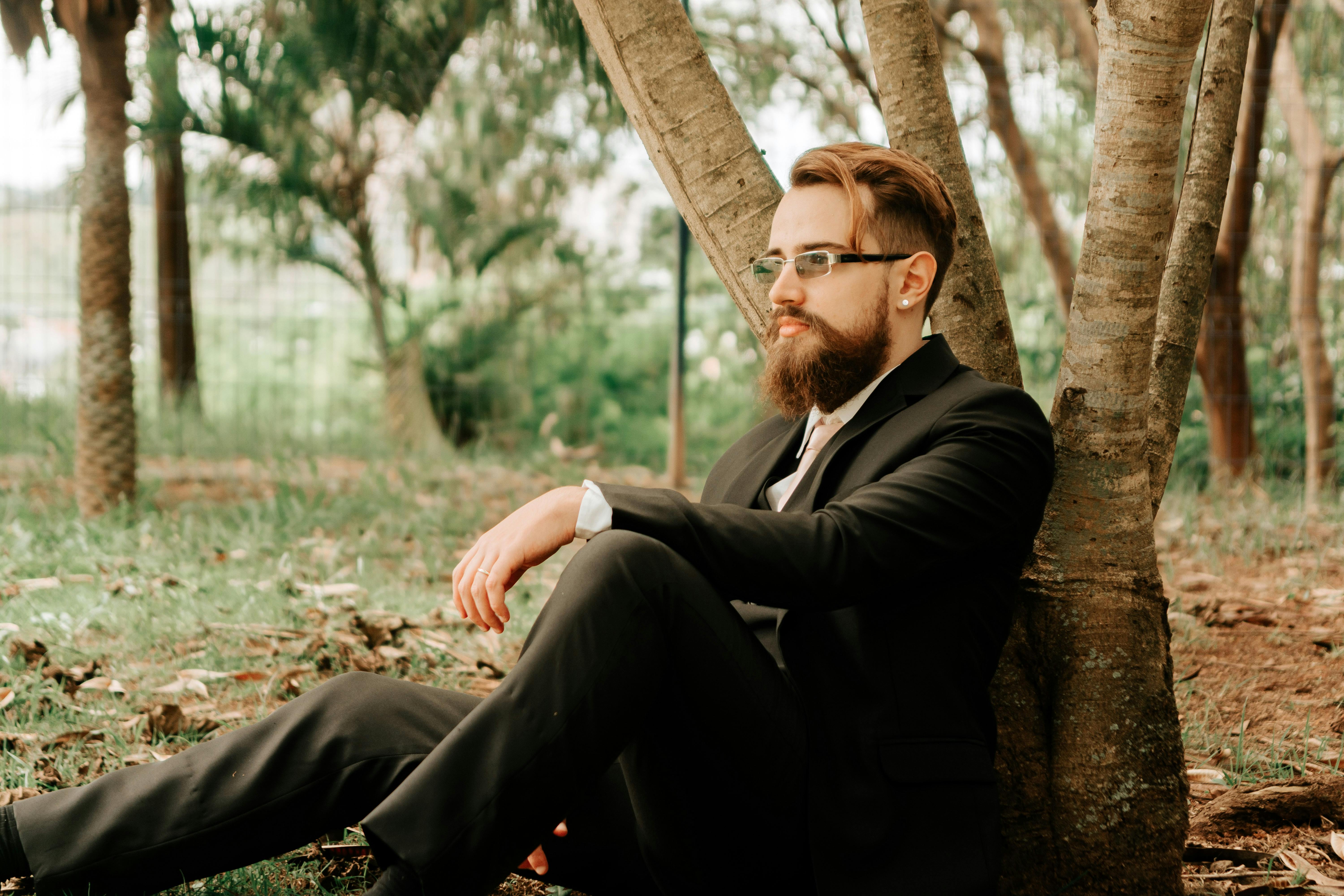 Man Sitting under the Tree · Free Stock Photo